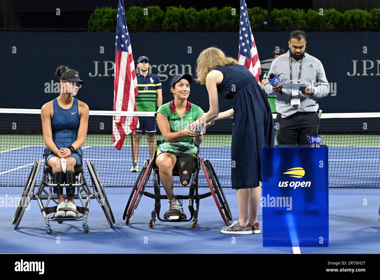 Maylee Phelps and Ksenia Chasteau are presented trophies during the ...
