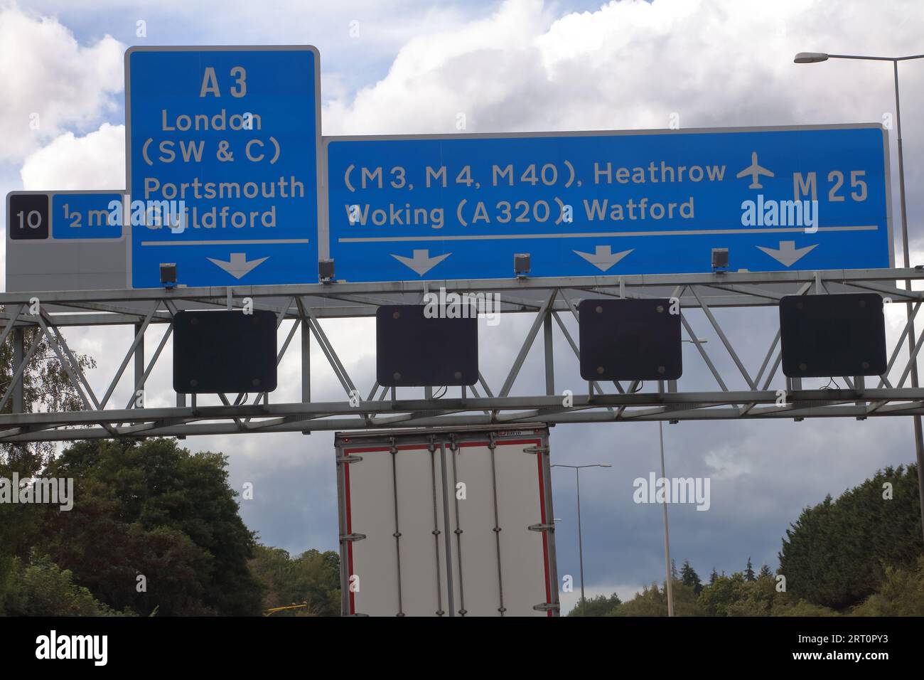 Overhead signage for Junction 10 on the M 25 Motorway showing turnoffs ...