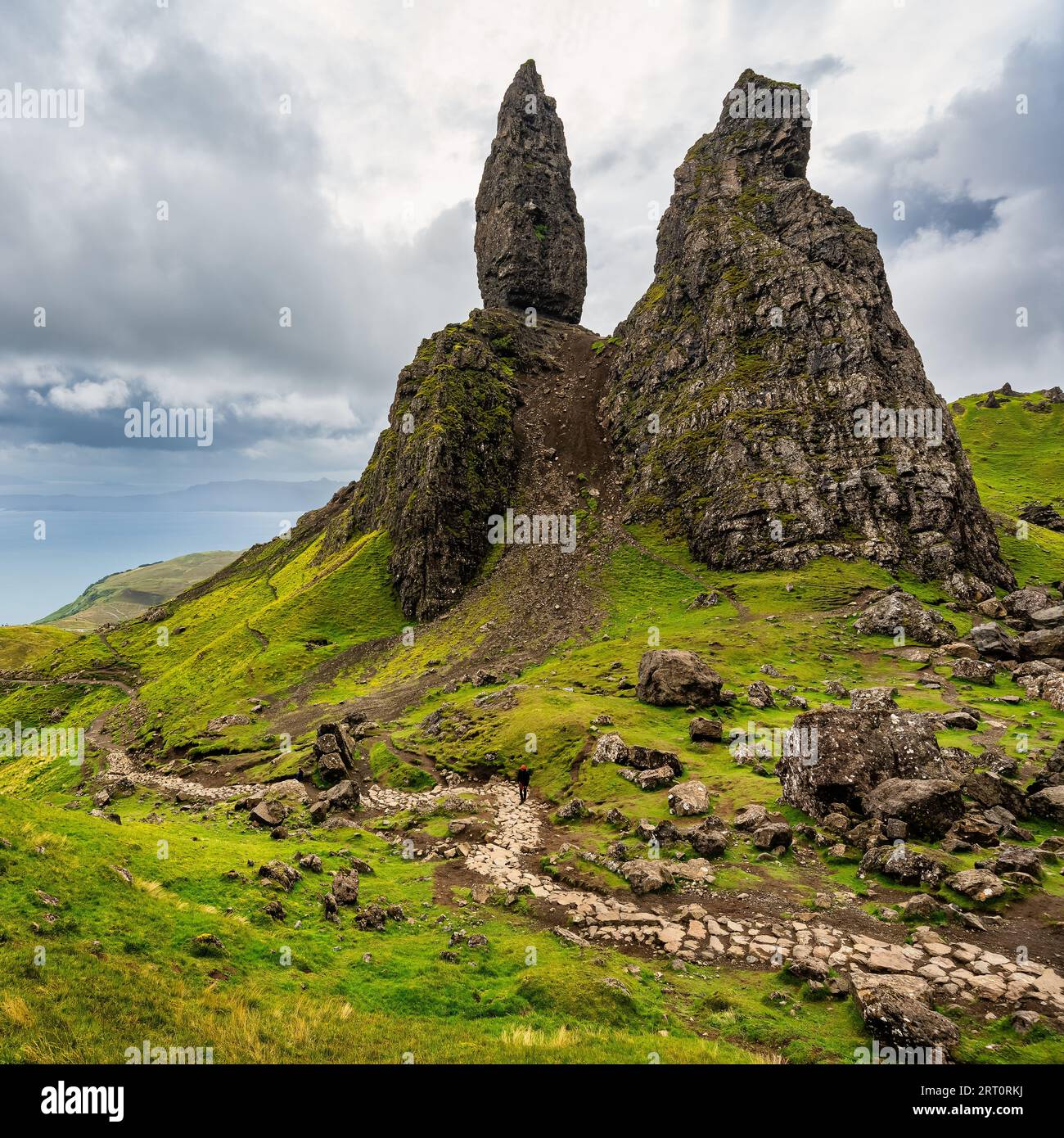 Hiker walk along a trail among the strange rocks of the landscape on ...