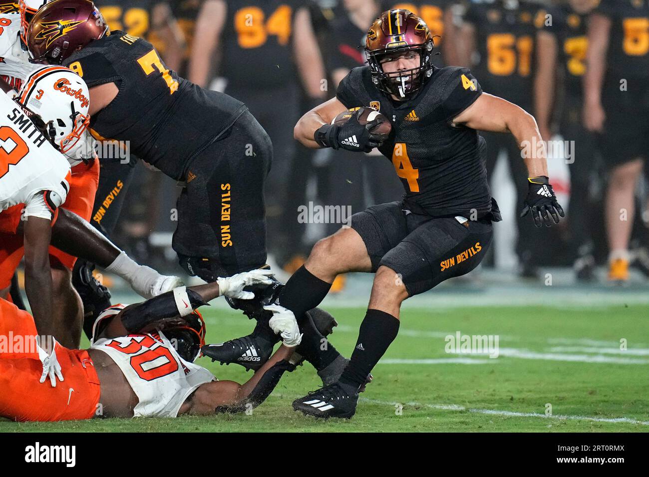Oklahoma State linebacker Collin Oliver (30) tackles Arizona State ...