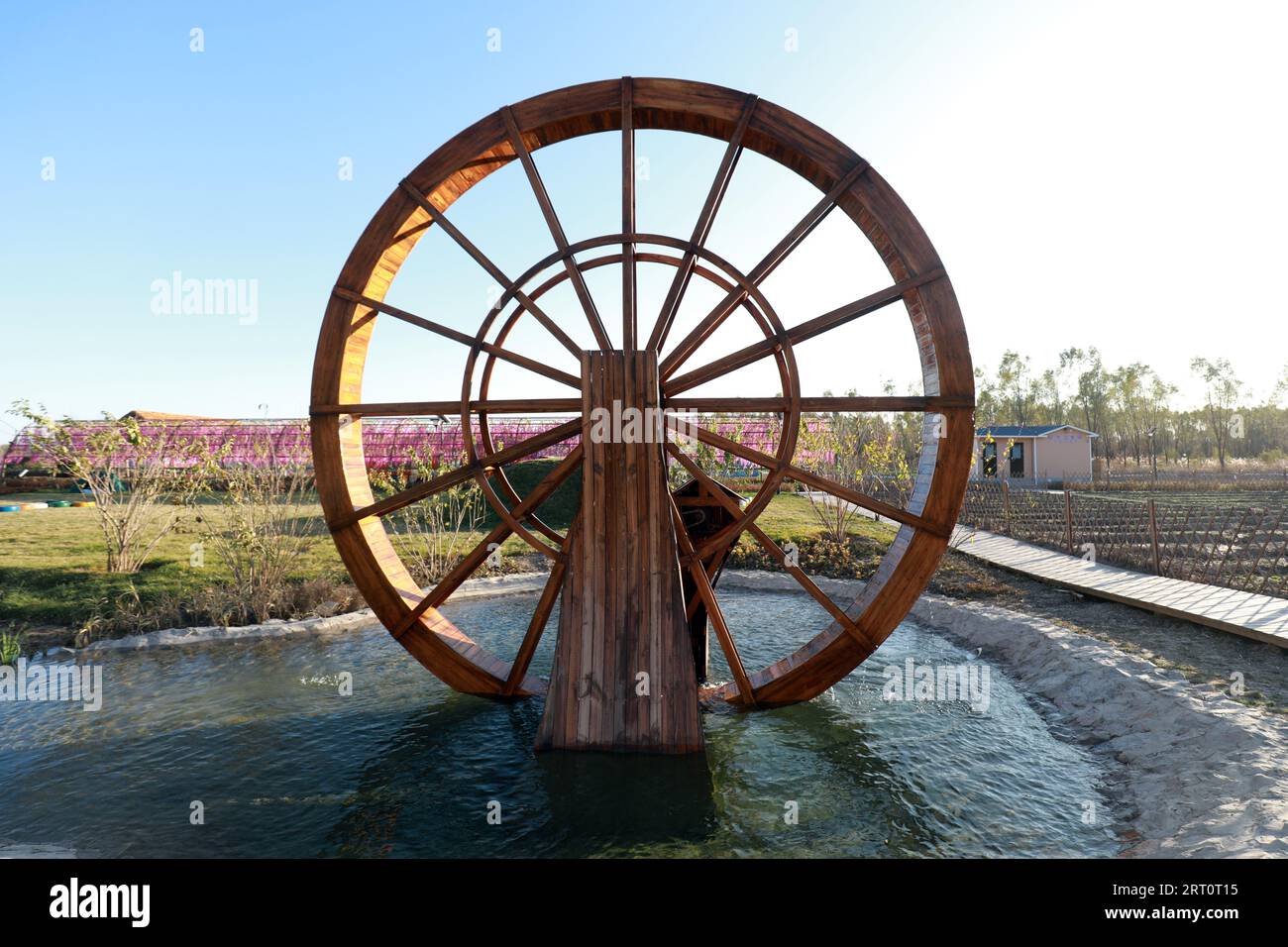 Wooden waterwheel architecture landscape in the park Stock Photo - Alamy