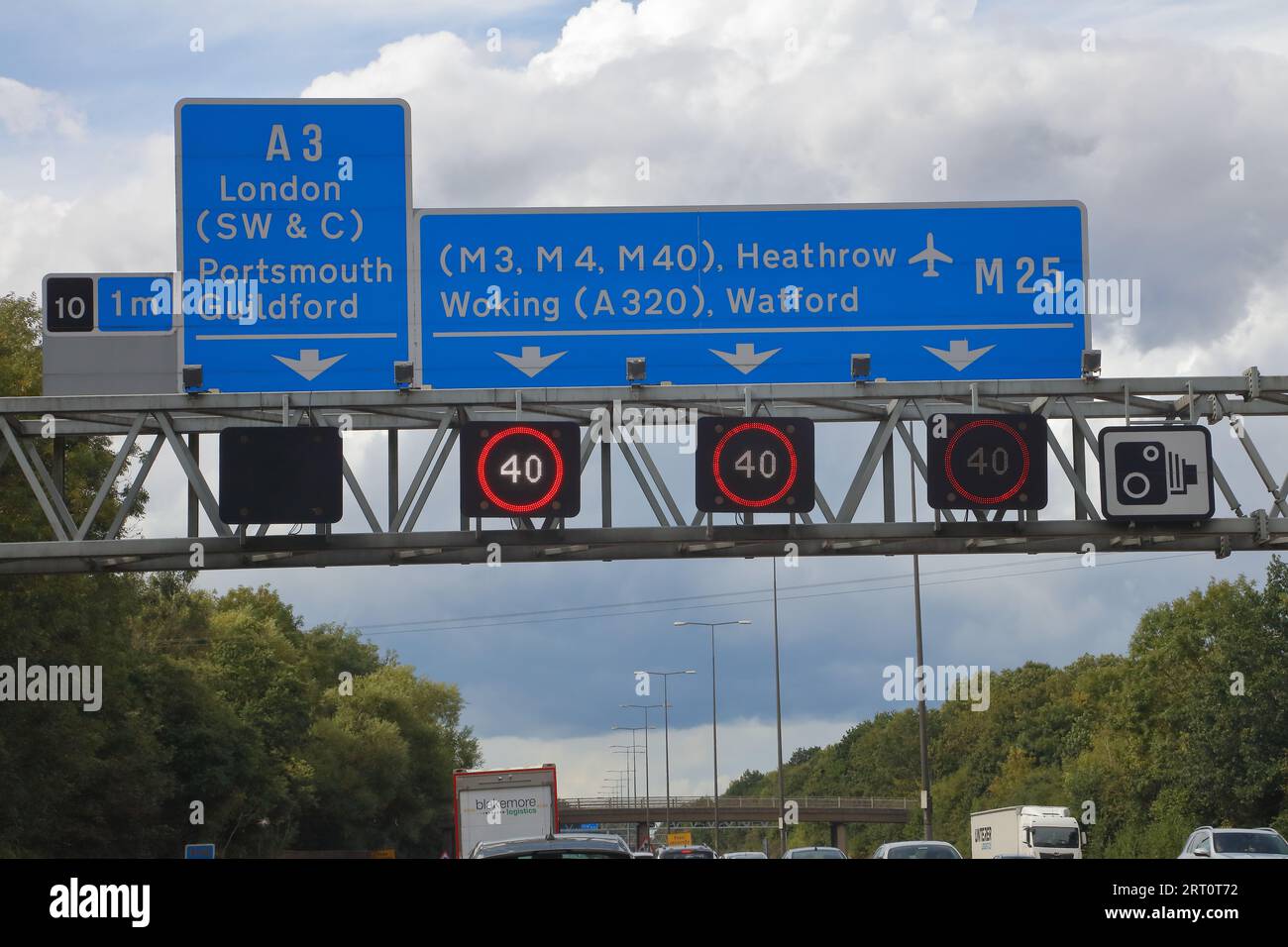 Overhead signage for Junction 10 on the M 25 near Wisley common showing ...