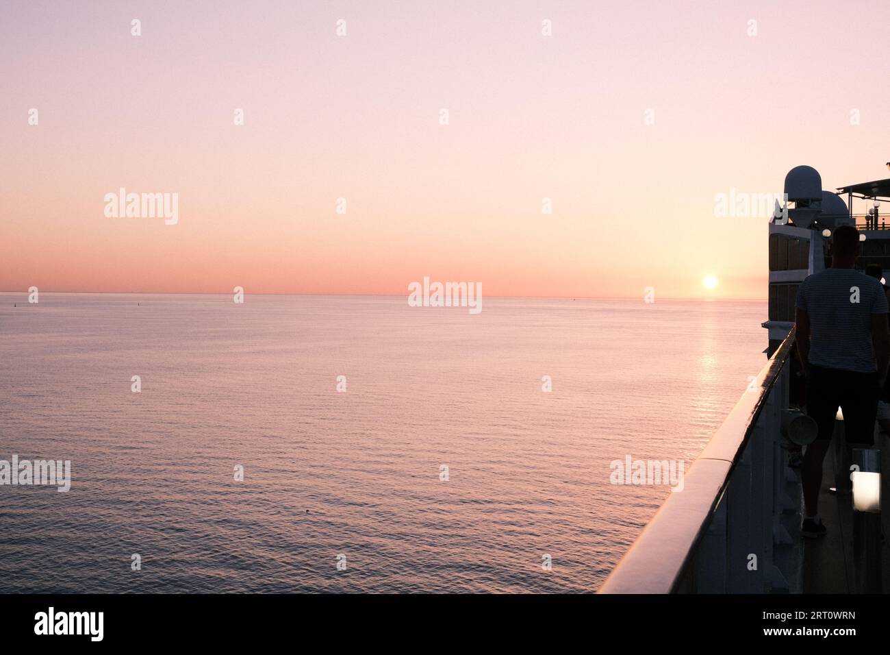 sunset aboard cruise ship Stock Photo - Alamy