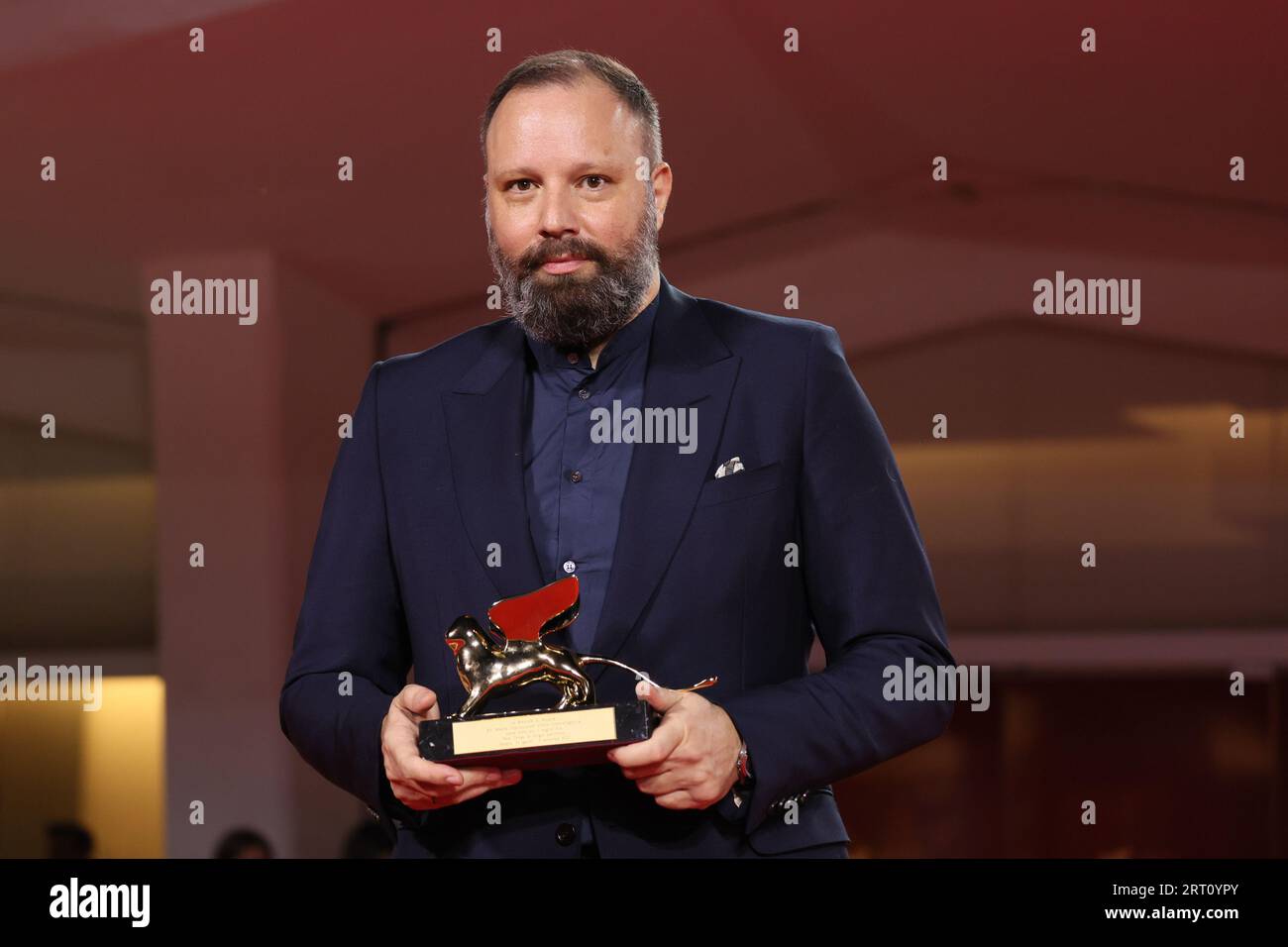 Yorgos Lanthimos poses with the Lion for Best Film for his film 'Poor ...