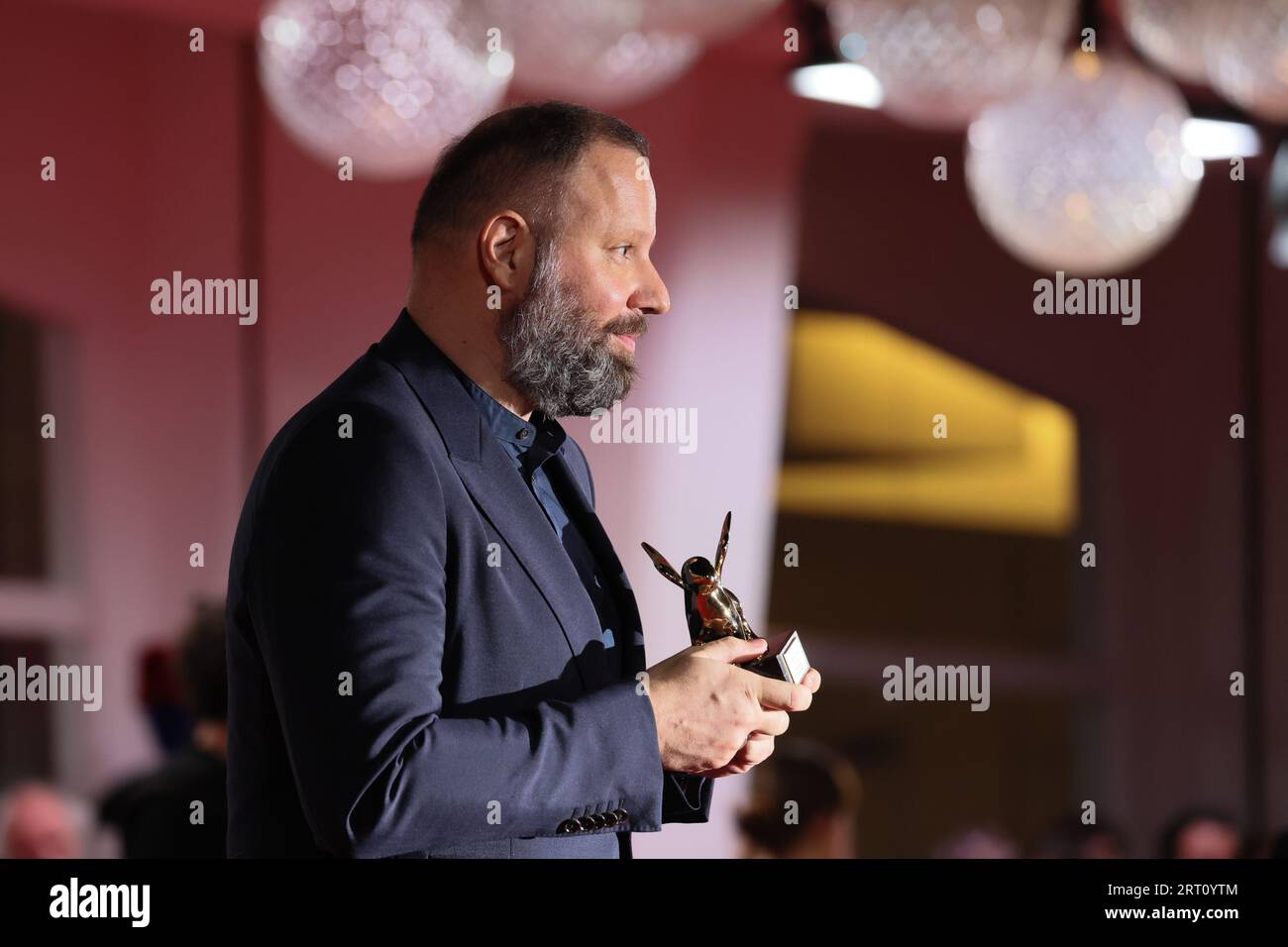 Yorgos Lanthimos poses with the Lion for Best Film for his film 'Poor ...