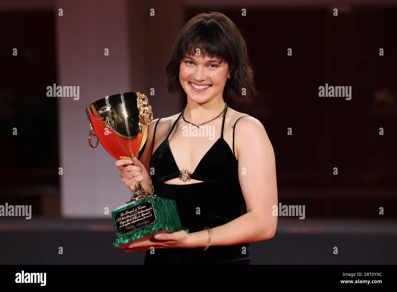 Cailee Spaeny poses with the Volpi Cup for Best Actress Award for ...