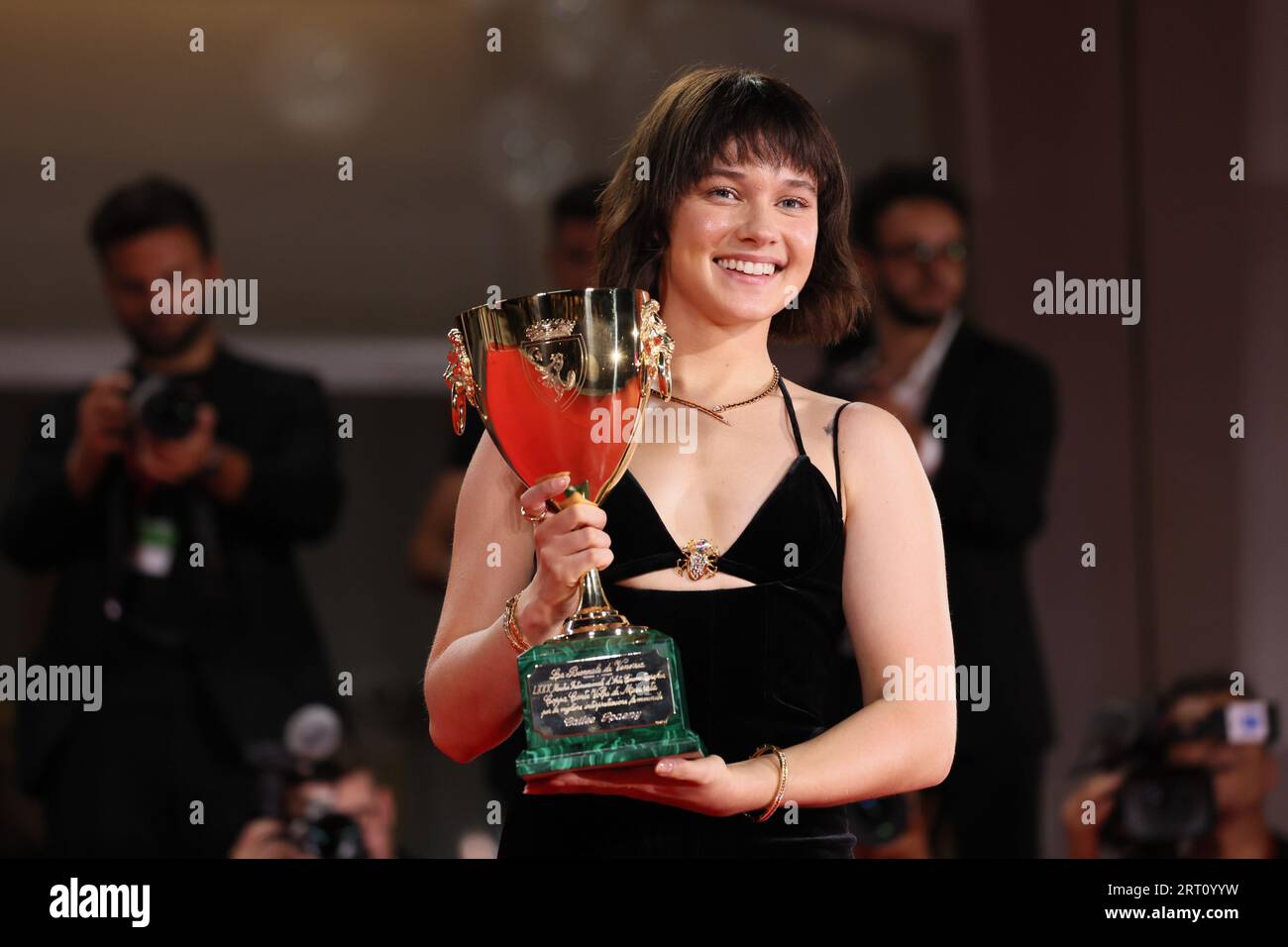 Cailee Spaeny poses with the Volpi Cup for Best Actress Award for ...