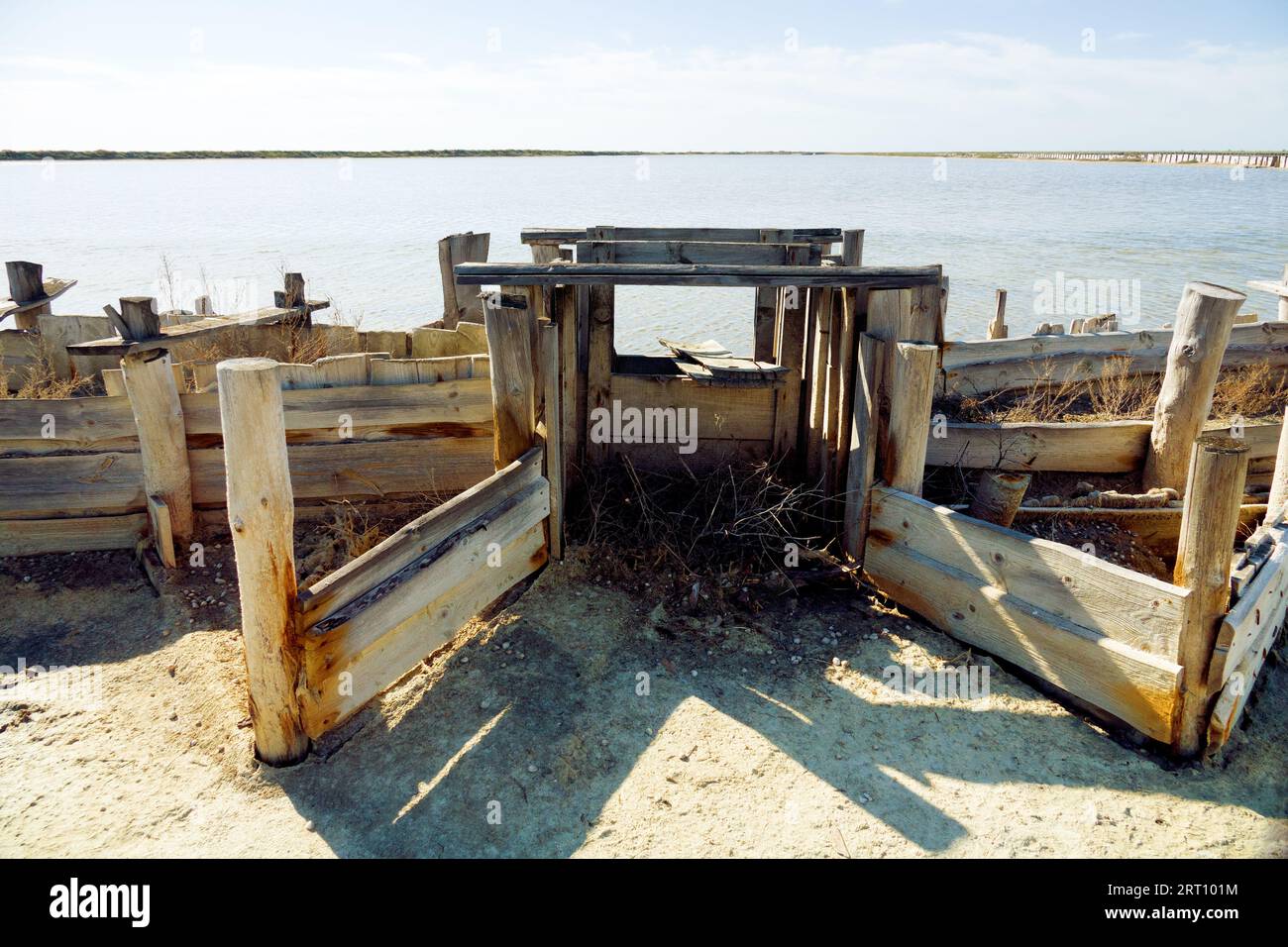 An ancient abandoned salt factory, saltworks. The remains of wooden ...