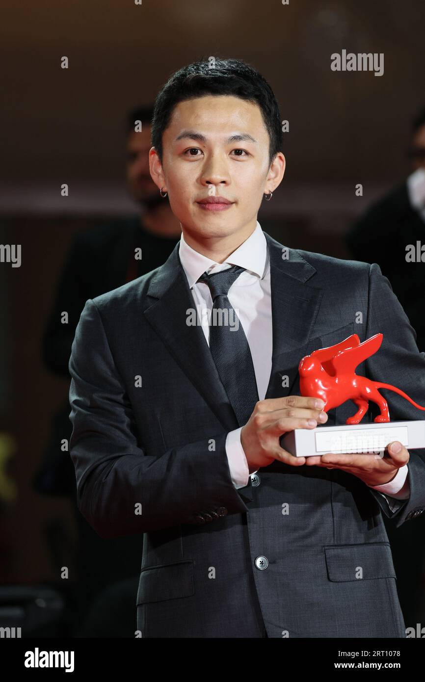 Lee Hong-Chi poses with the Lion of the Future - Luigi De Laurentiis Award for a Debut Film for ...