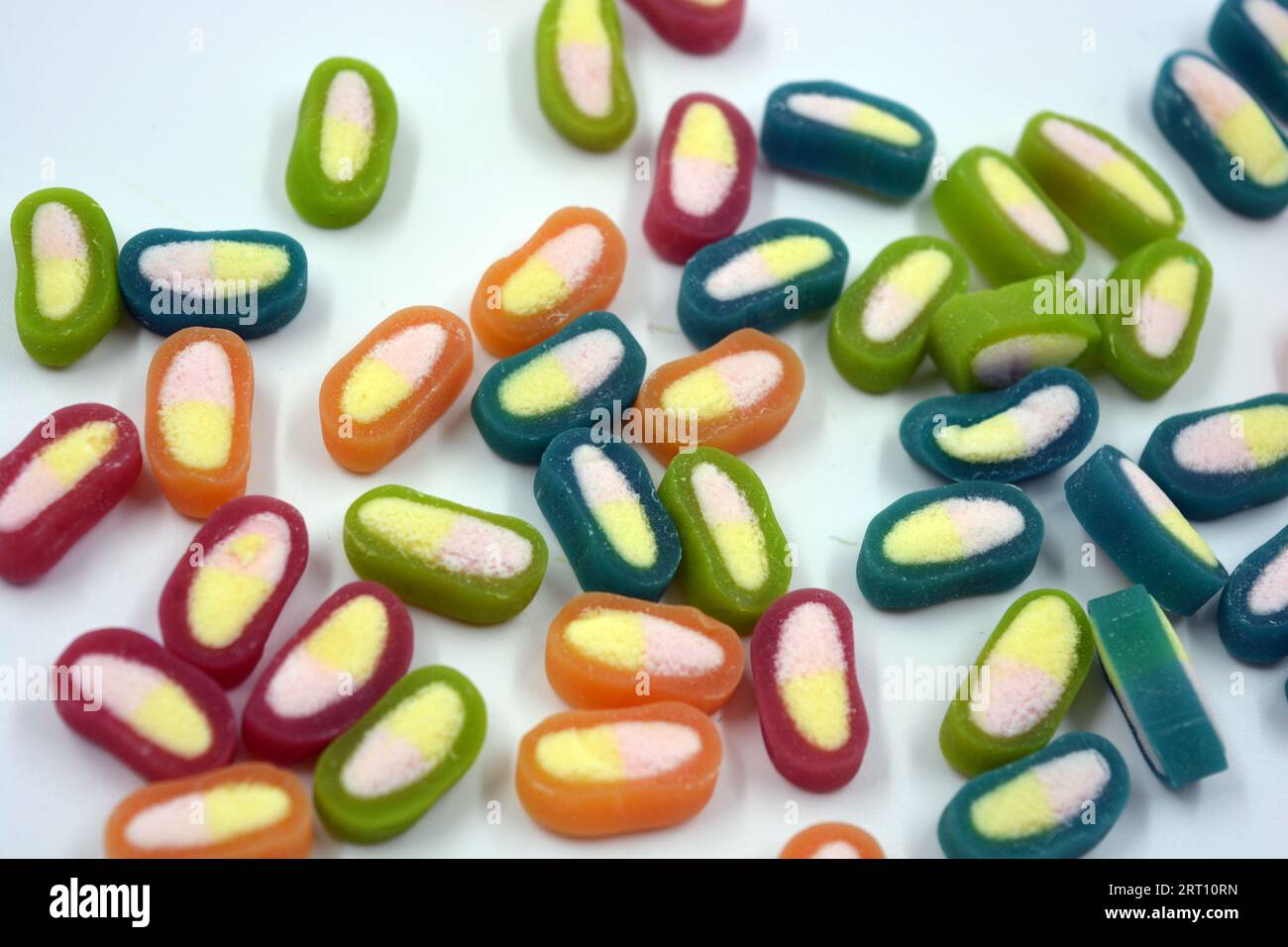 Interesting and unusual, colored caramel candies, sweets with a white ...