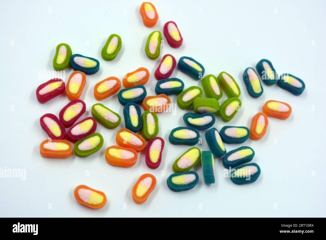 Interesting and unusual, colored caramel candies, sweets with a white ...