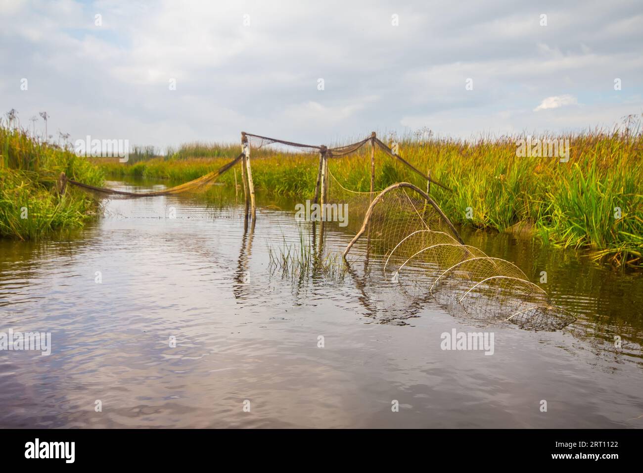 Old trap net (bent willow branches used); fyke hoop net on fishway of ...