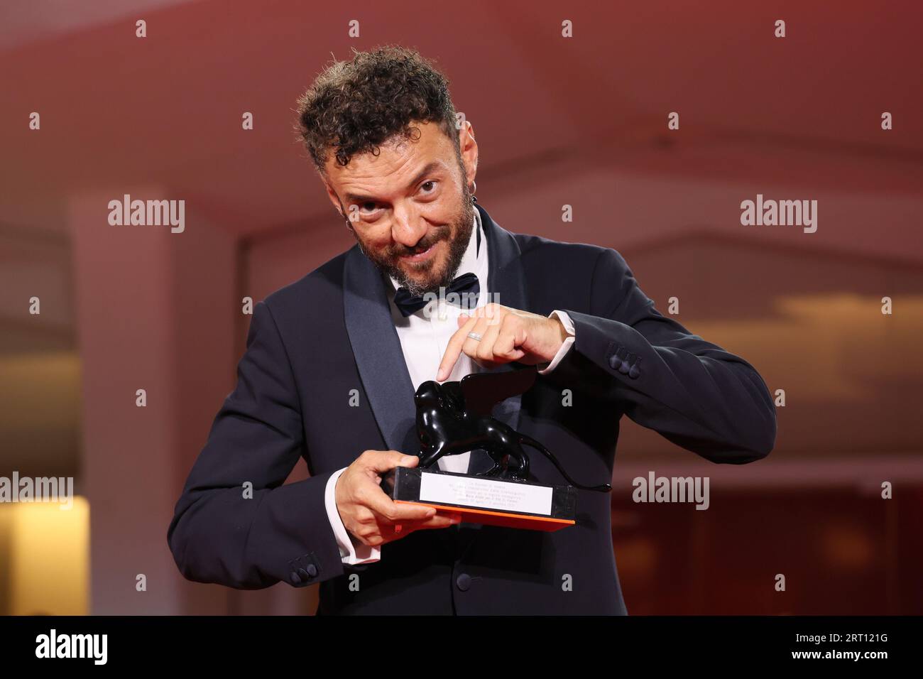 Enrico Maria Artale poses with the Best Screenplay Award for film 'El ...