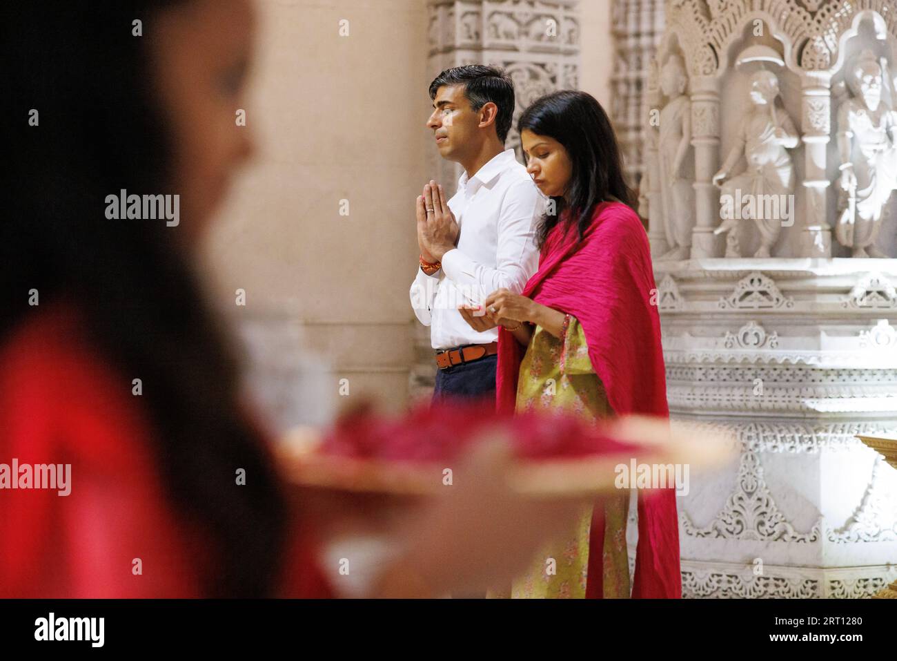 Prime Minister Rishi Sunak and his wife Akshata Murty offer prayers ...
