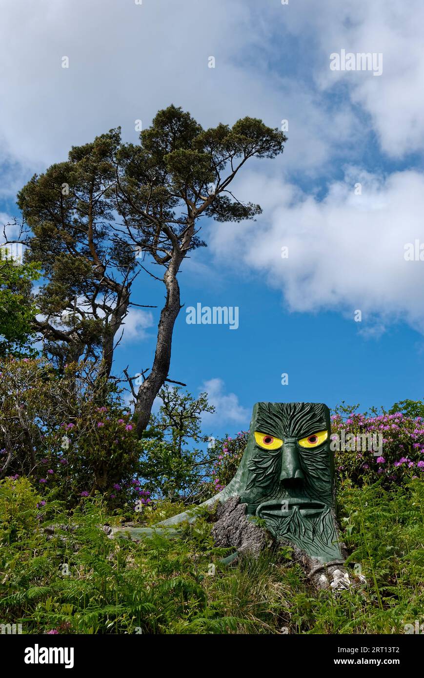 A Felled Tree Stump carved in the shape of a Forest Monster with Yellow ...