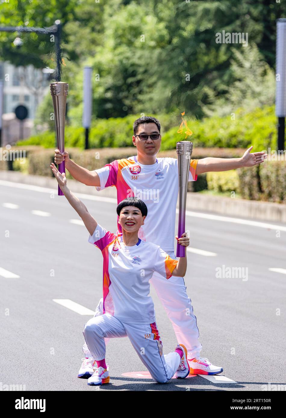 Jiaxing, China's Zhejiang Province. 10th Sep, 2023. Torch bearers Xu Bingwu (top) and Wang ...