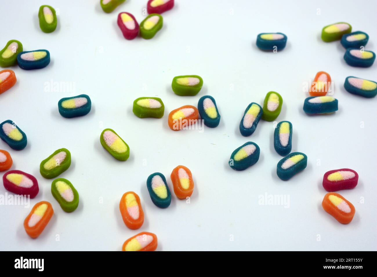 Interesting and unusual, colored caramel candies, sweets with a white ...