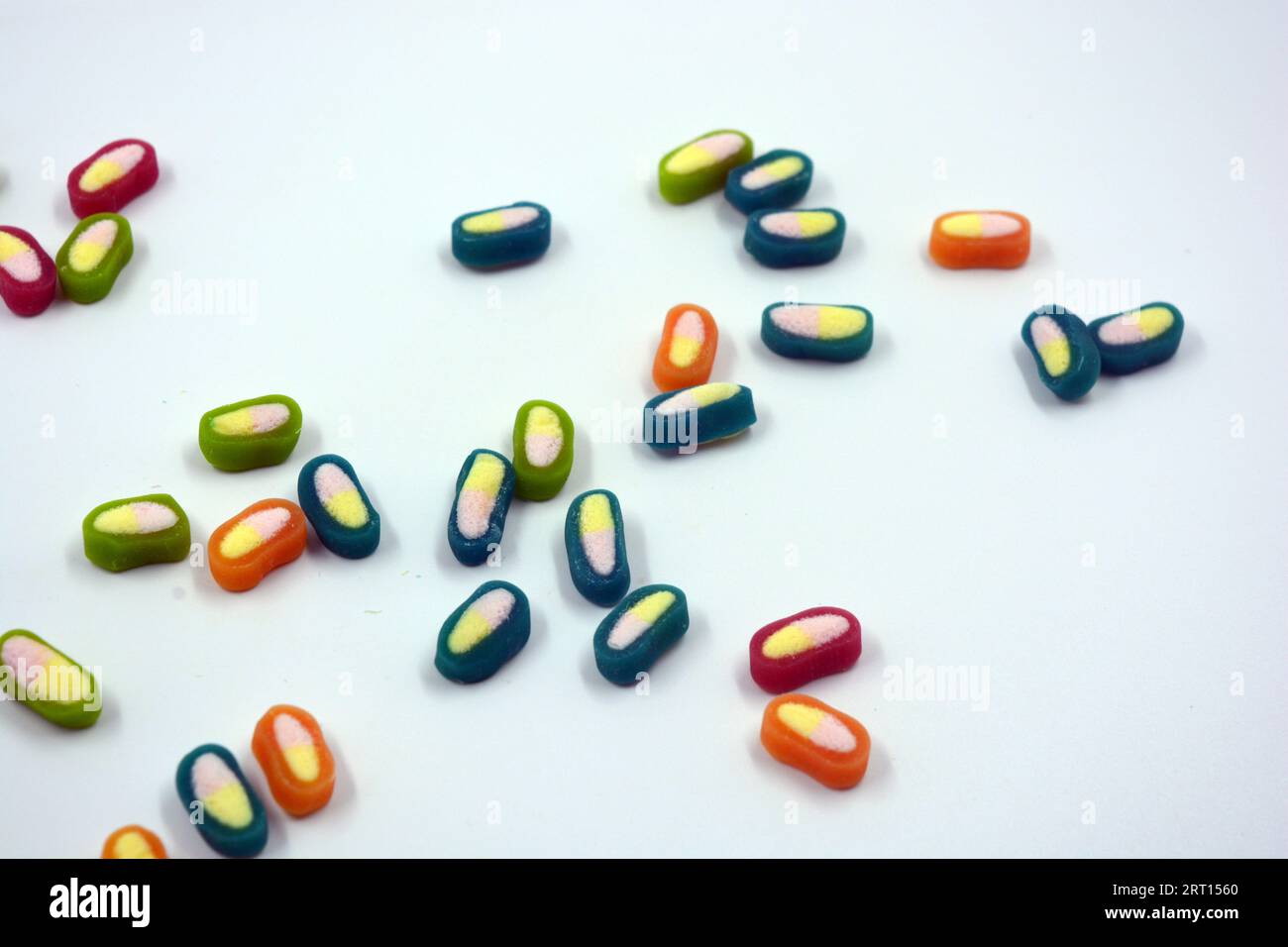 Interesting and unusual, colored caramel candies, sweets with a white ...