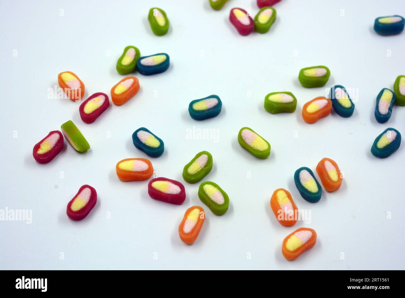 Interesting and unusual, colored caramel candies, sweets with a white ...