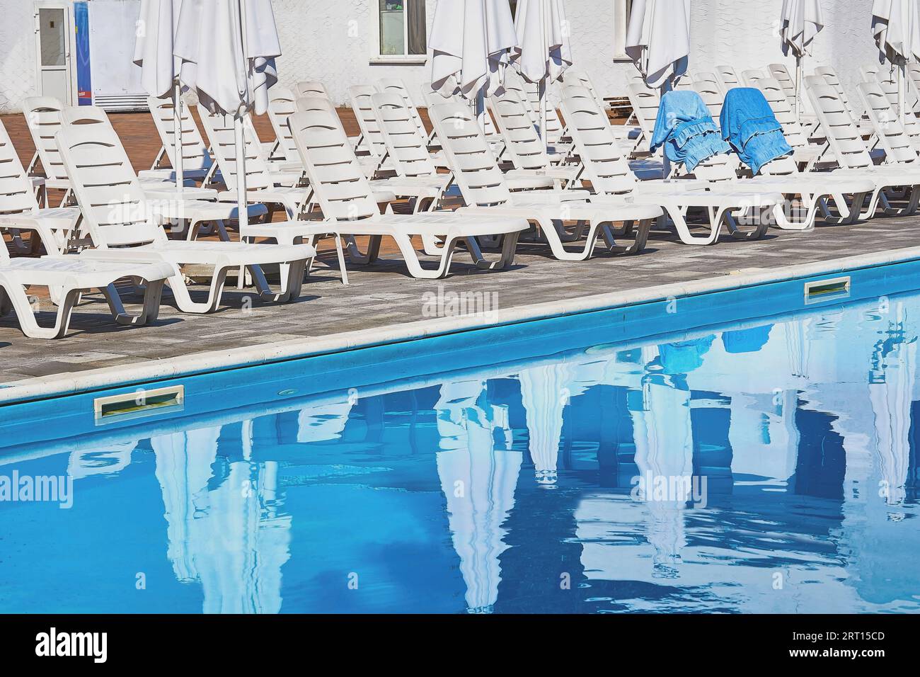 Summer outdoor pool at the resort with sun loungers before the arrival ...