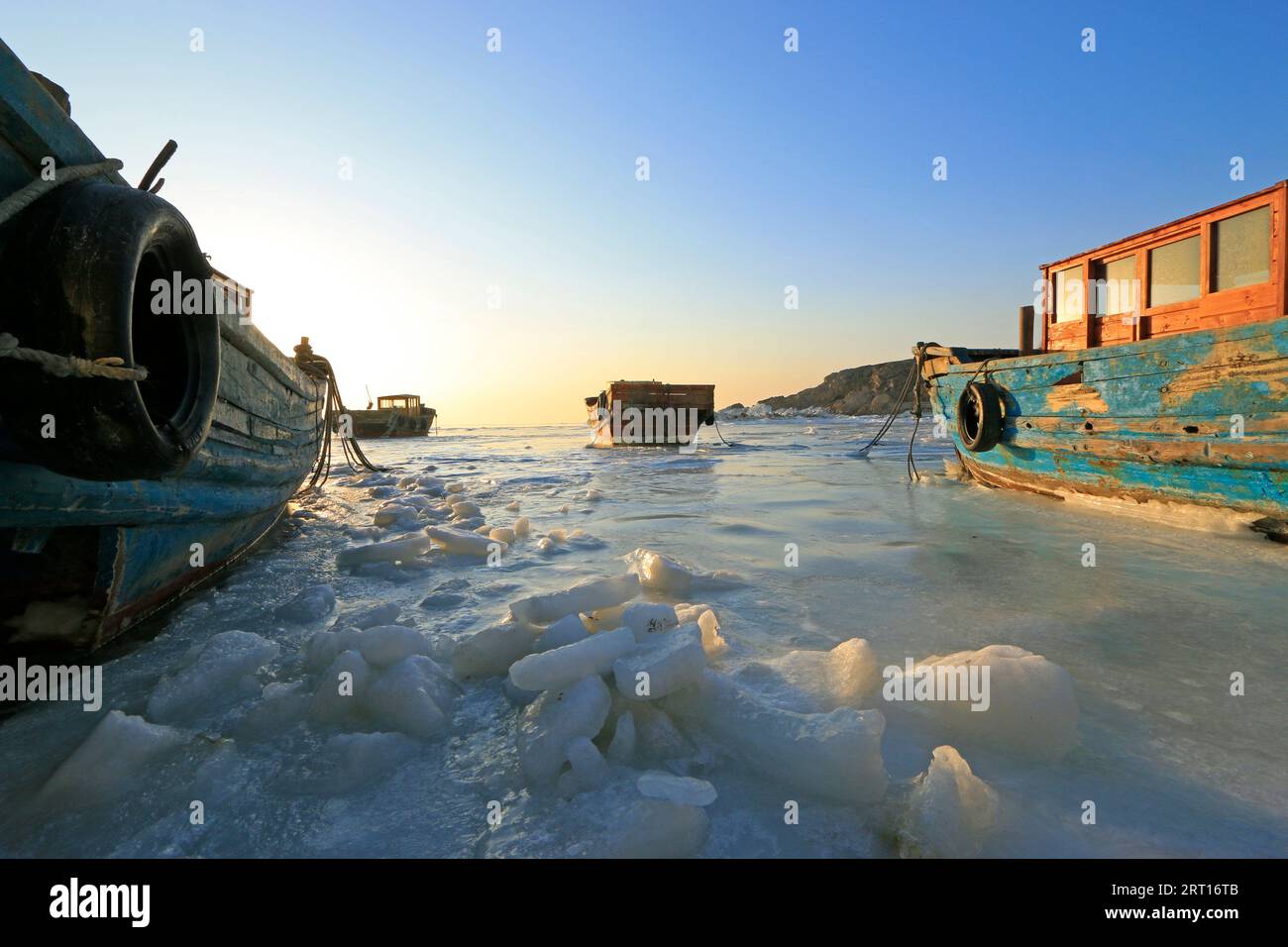 wooden boat in sea ice Stock Photo - Alamy