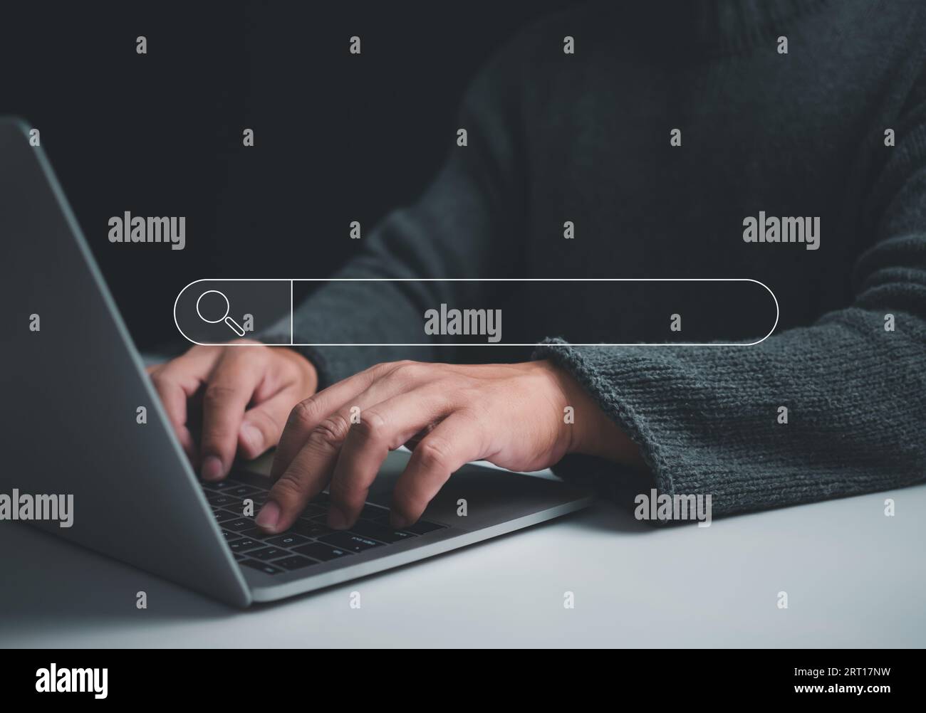 Human hand working on computer and search icon. The concept of ...