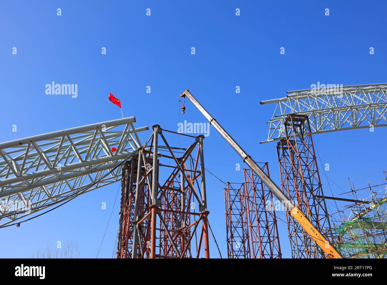 Truss girder and crane under blue sky Stock Photo - Alamy