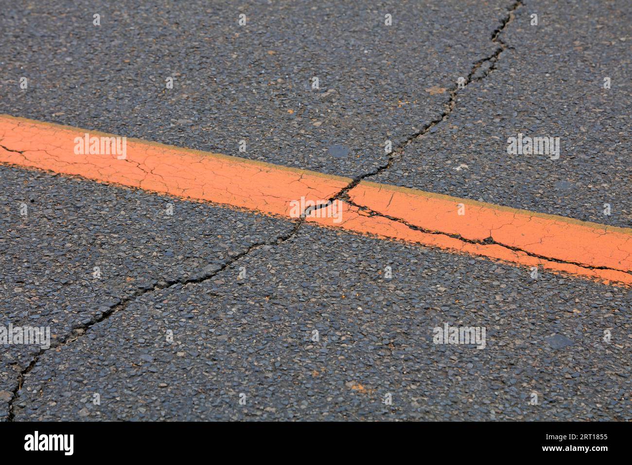 Yellow lines and crack in asphalt roads, closeup of photo Stock Photo ...