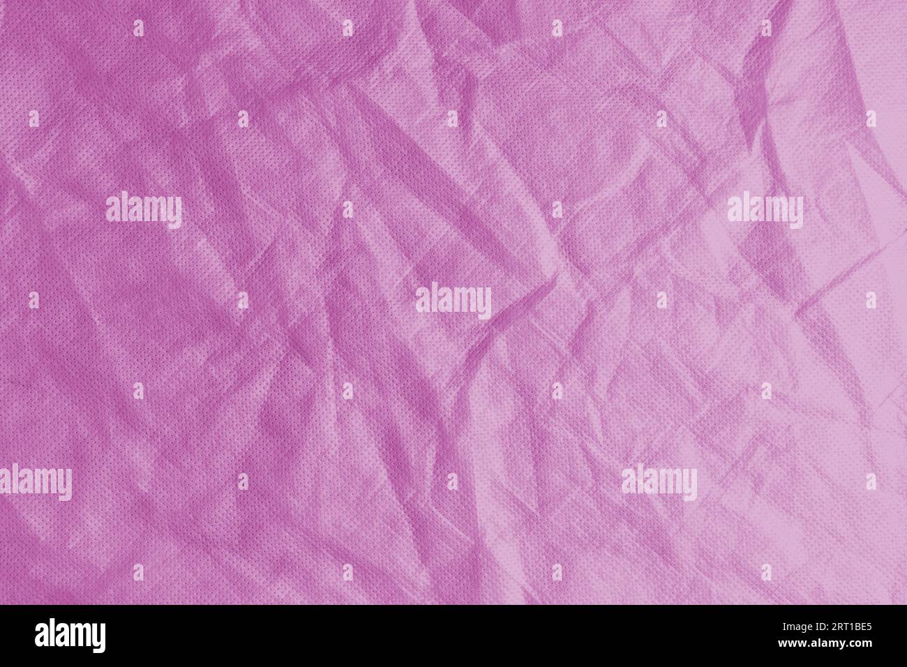 Wrinkled, crumpled pink fabric texture background. Wrinkled and creased ...