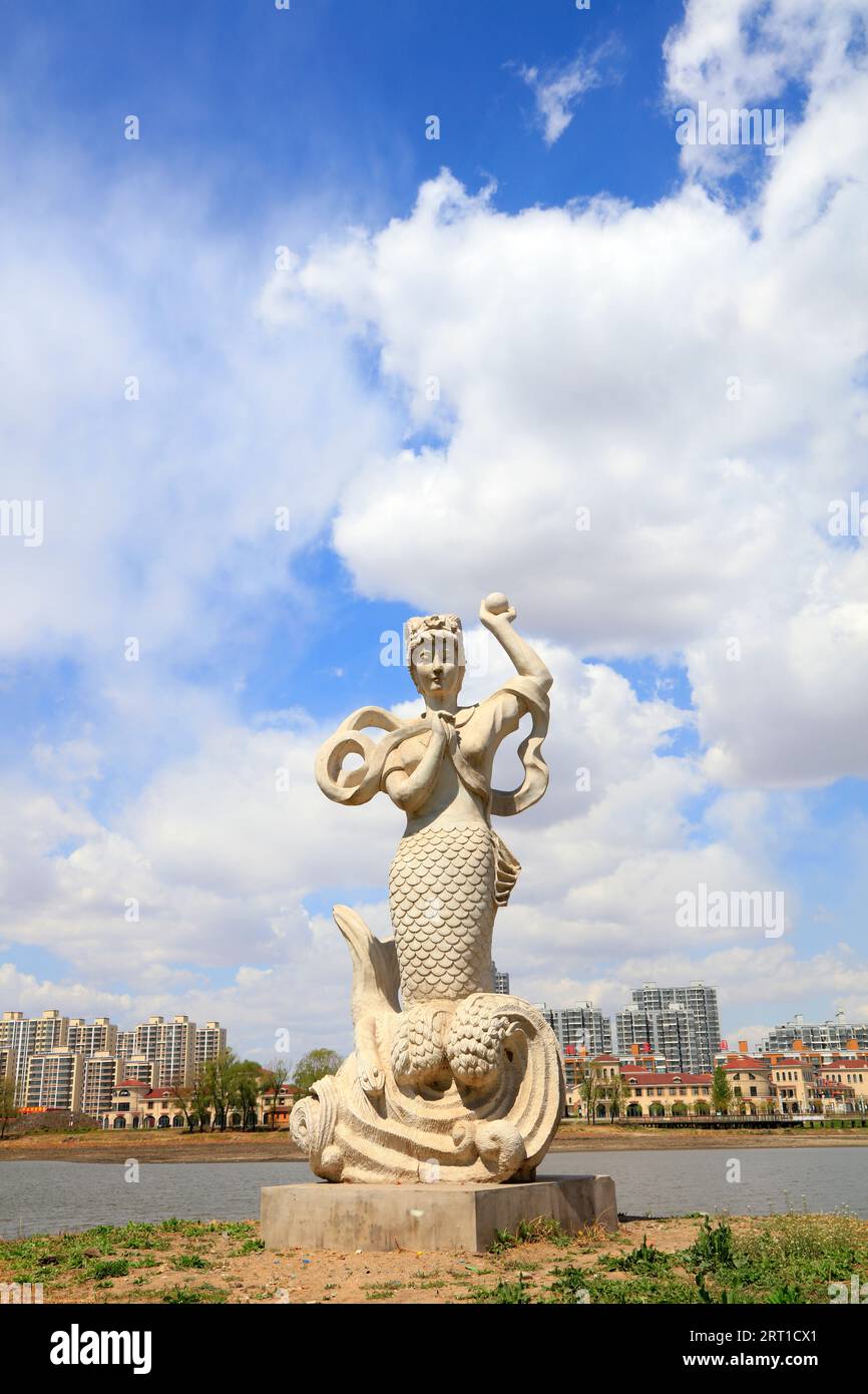 Mermaid sculpture in a garden Stock Photo - Alamy