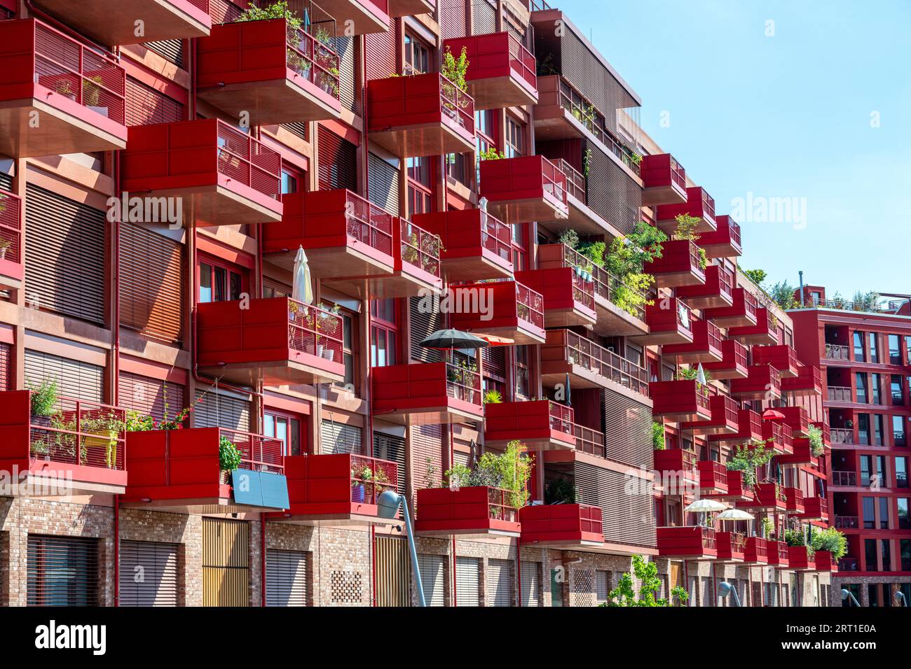Red modern apartment building seen in Berlin, Germany Stock Photo - Alamy