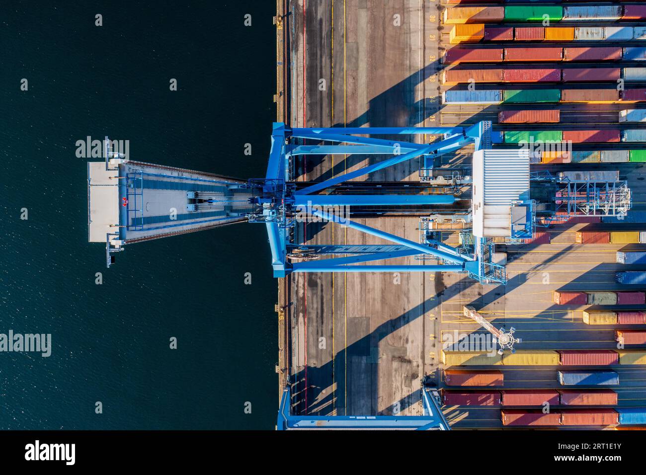 Aerial top down drone view of crane at a container terminal Stock Photo ...