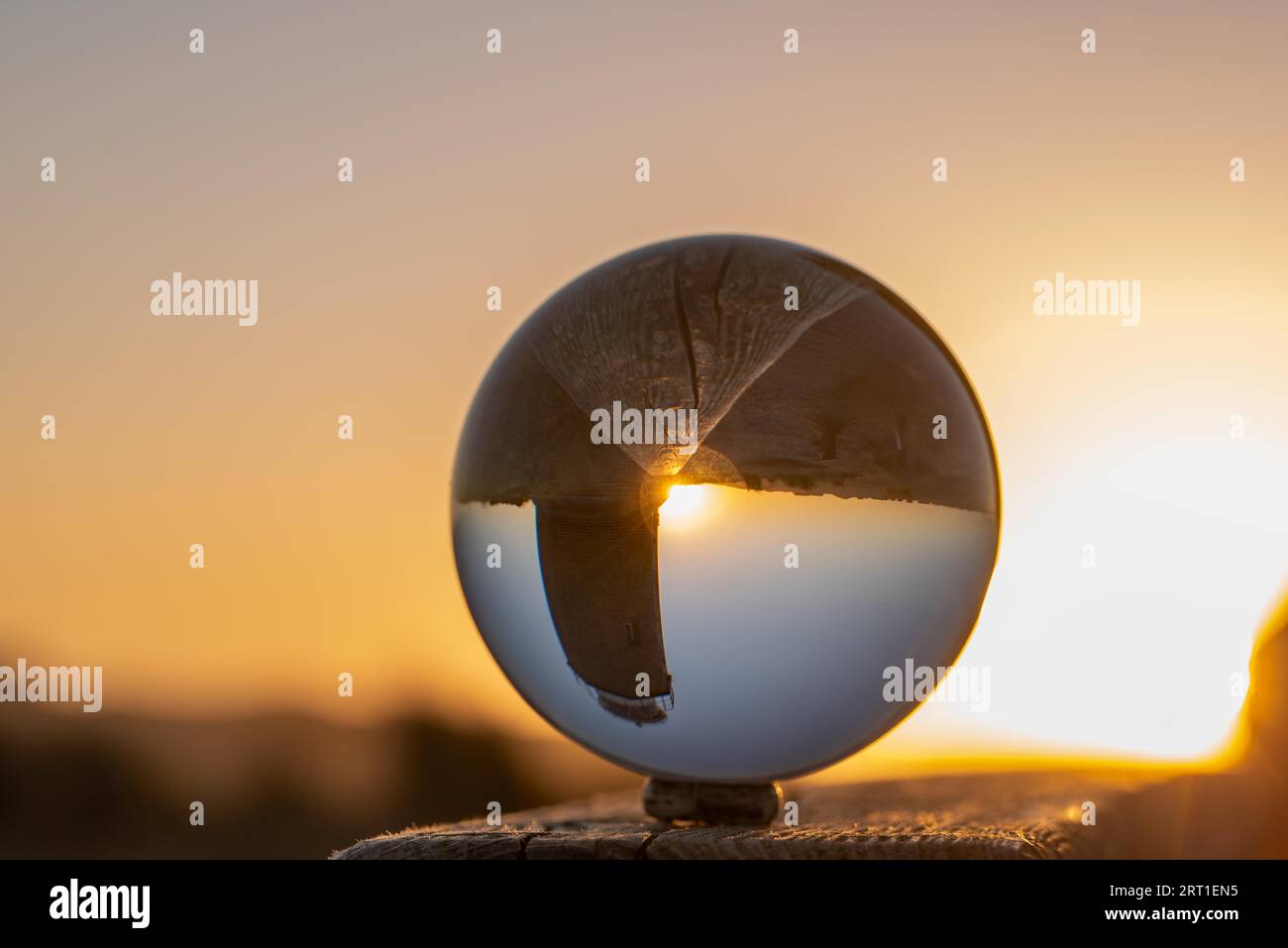 Lensball Photography with the Red Cliff Cross Light Stock Photo - Alamy