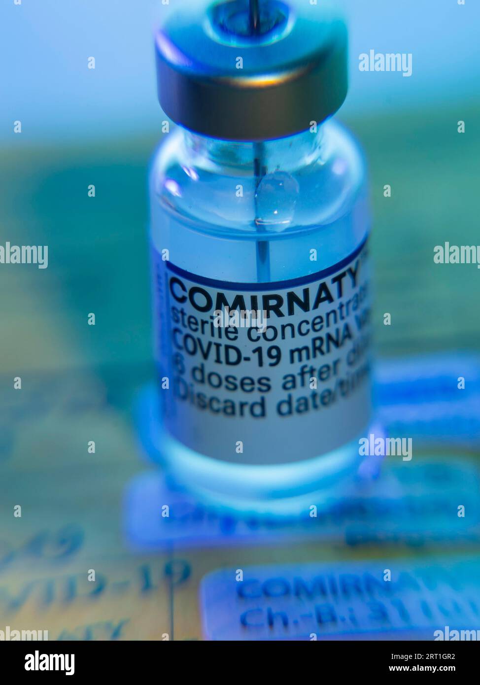 Symbolic image Corona vaccine Comirnaty in front of a vaccination card ...