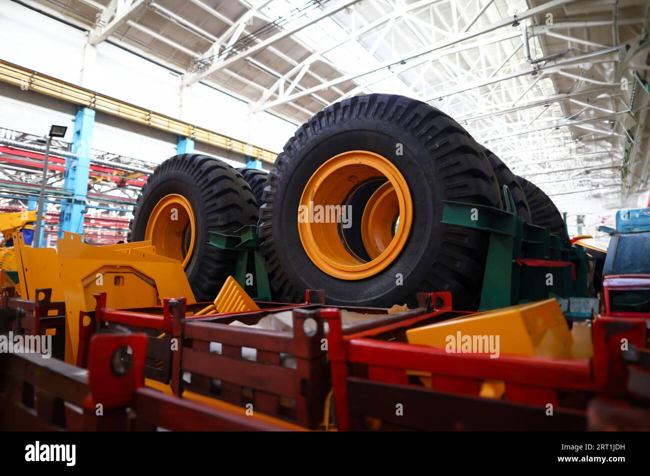 Set of extremely big wheels standing at warehouse Stock Photo - Alamy
