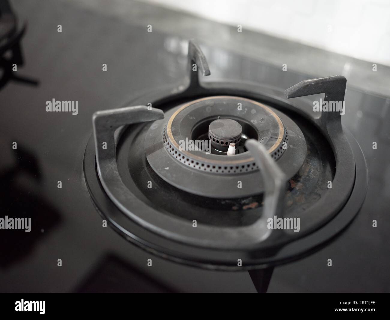 Modern gas stove built into a black table in the kitchen Stock Photo ...