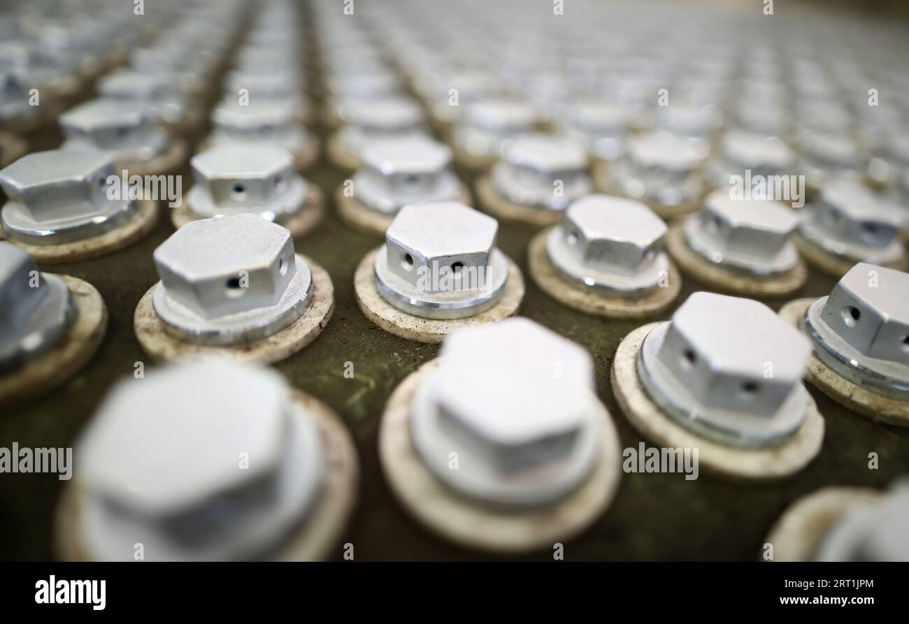 Pile of bolts in special box at industrial plant Stock Photo - Alamy