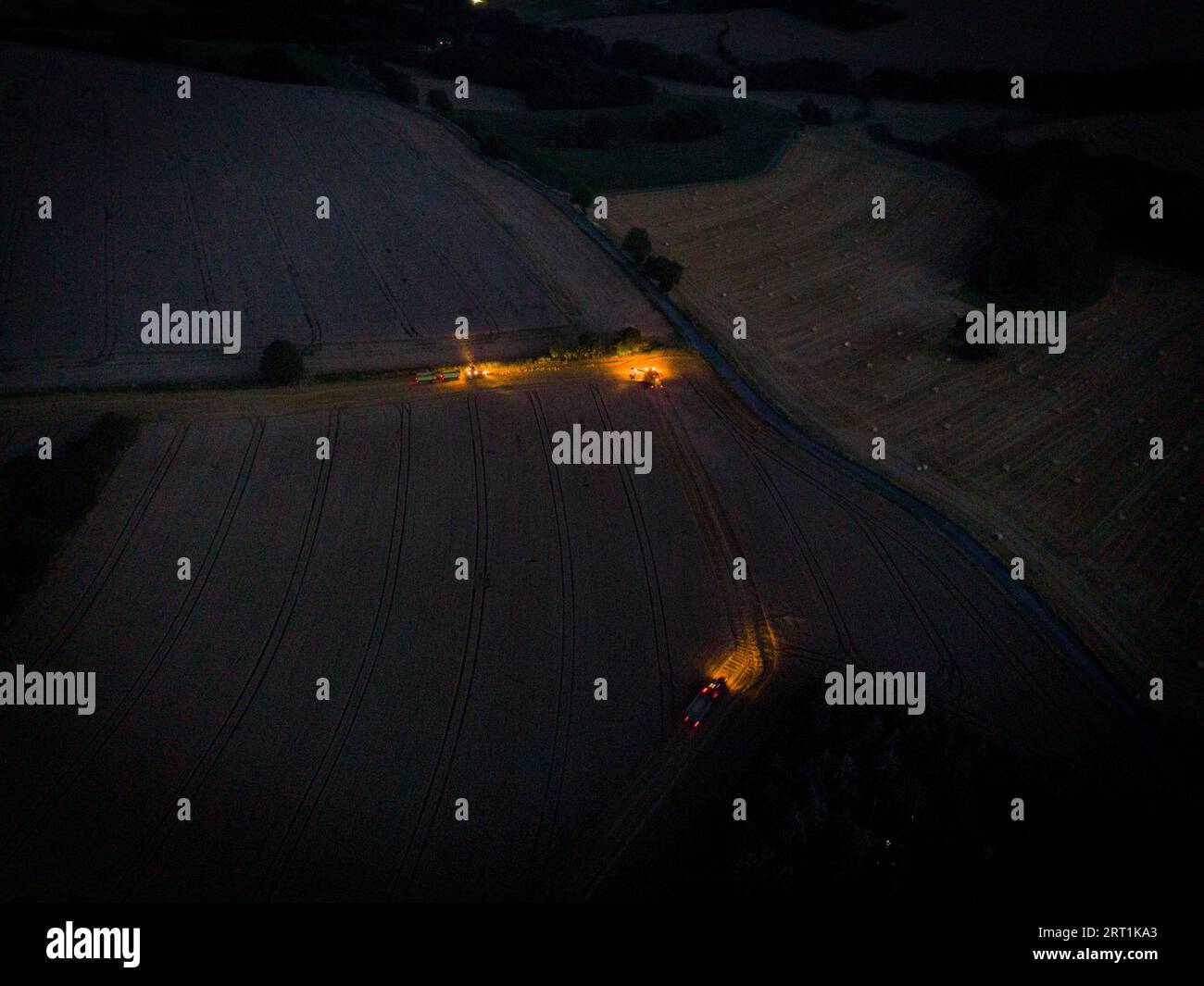 A combine harvester harvests a grain forest. When it is harvest time ...