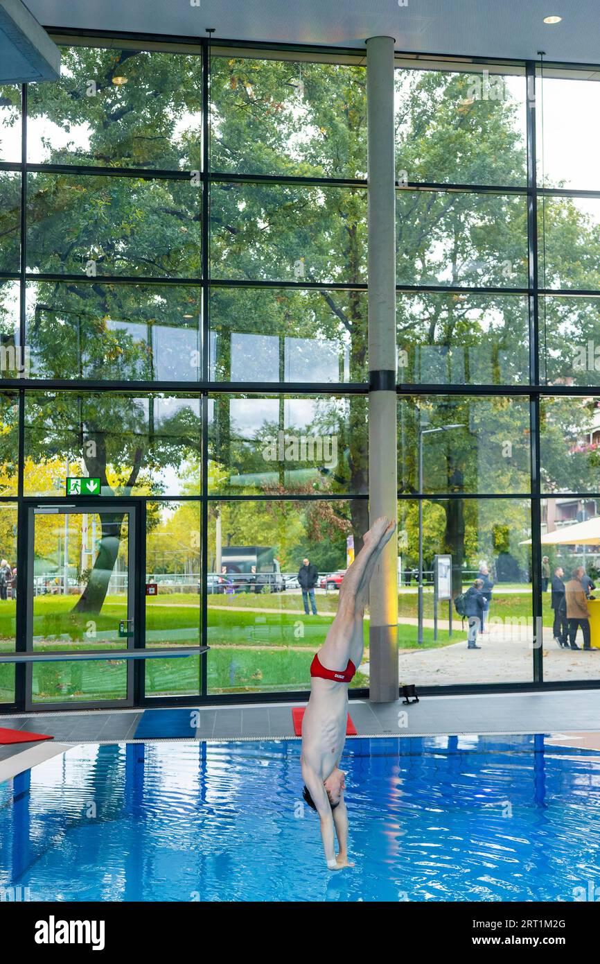 Person diving into swimming pool hi-res stock photography and images ...