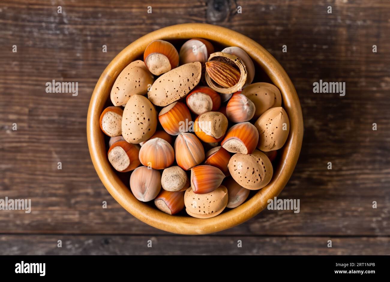 dried fruit inside bowl on antique wooden table Stock Photo - Alamy