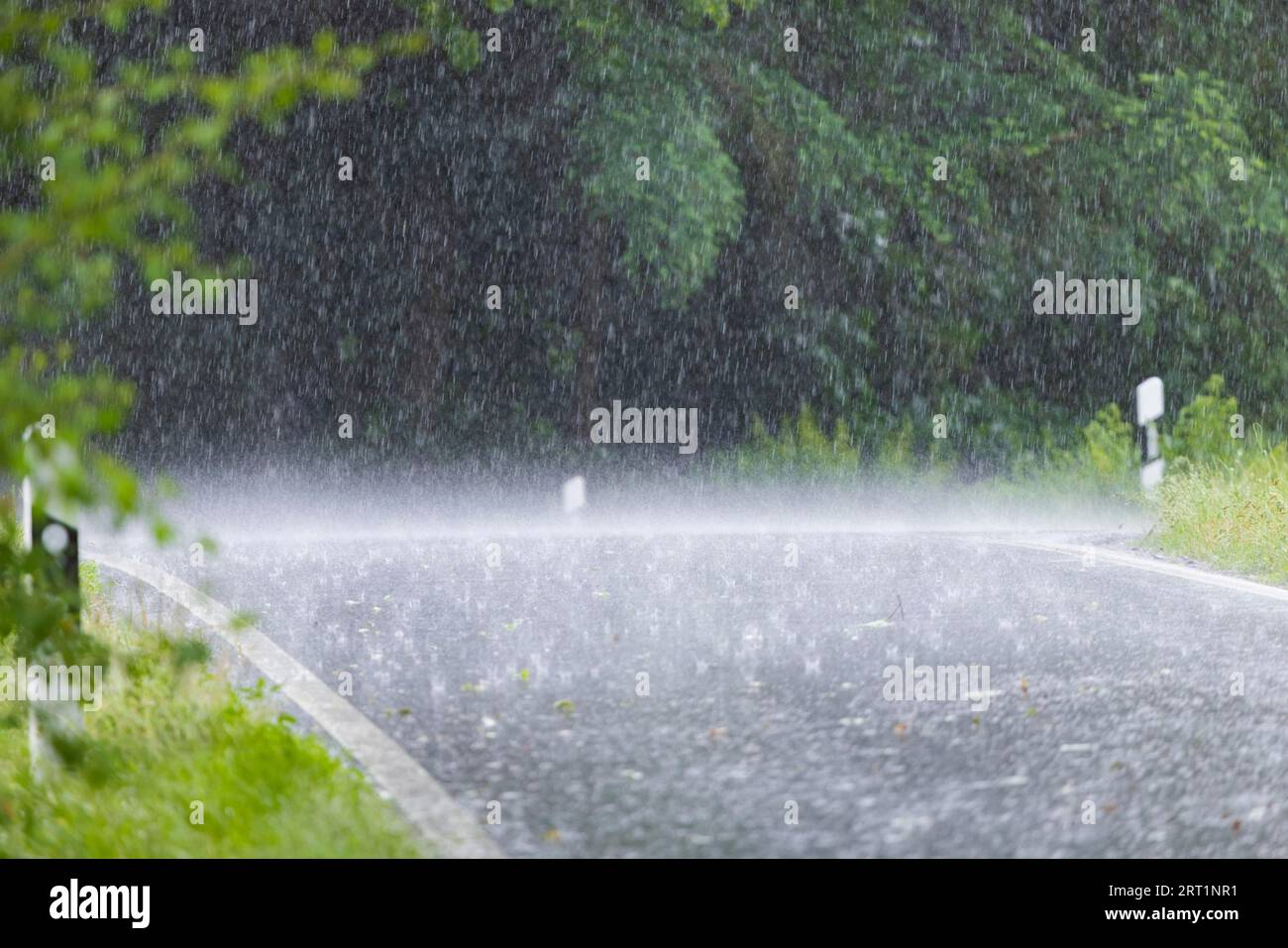 Pelting summer rain on a road near Schrfenstein Stock Photo - Alamy