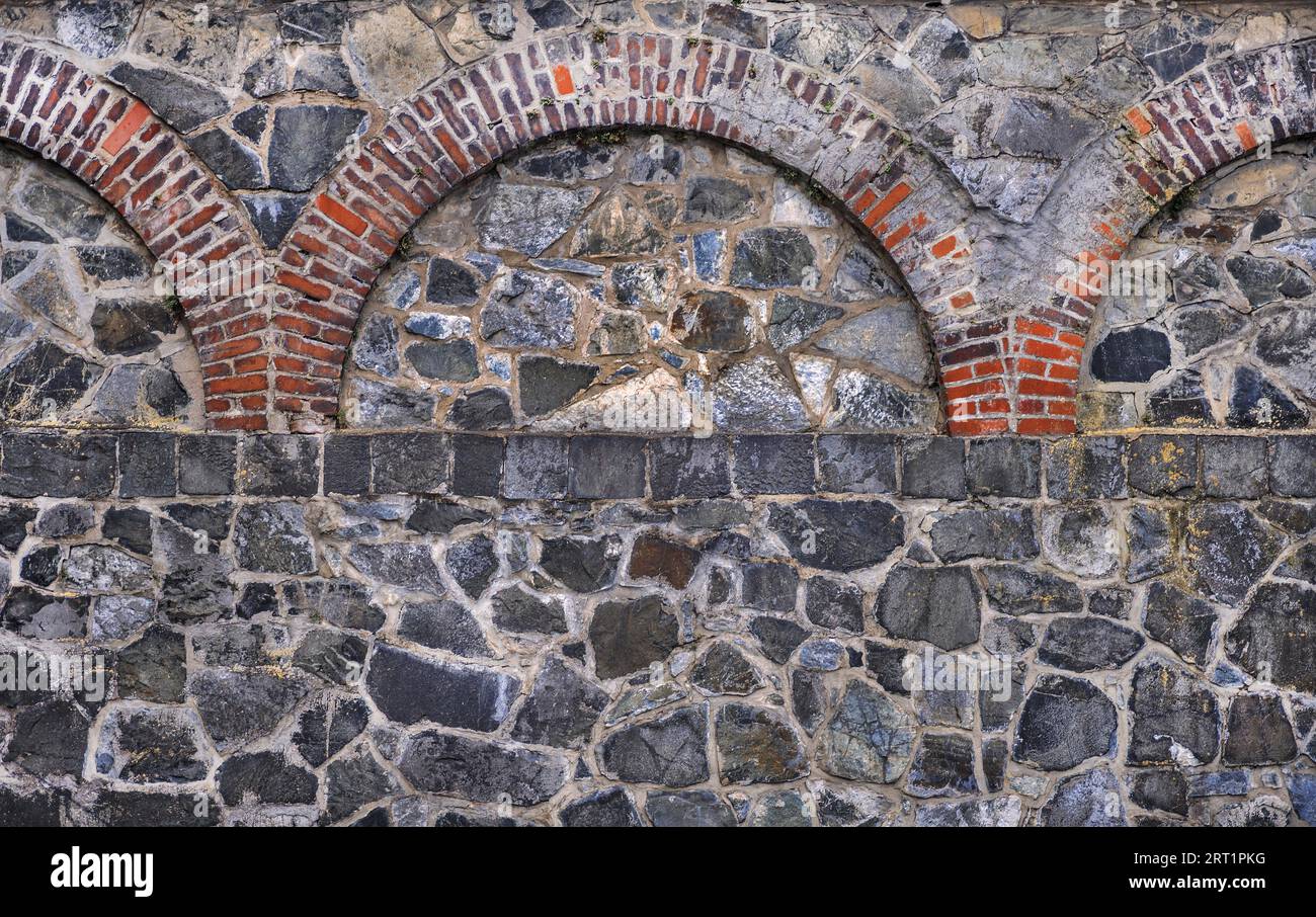 Old quarry stone wall with brick ornaments Stock Photo - Alamy