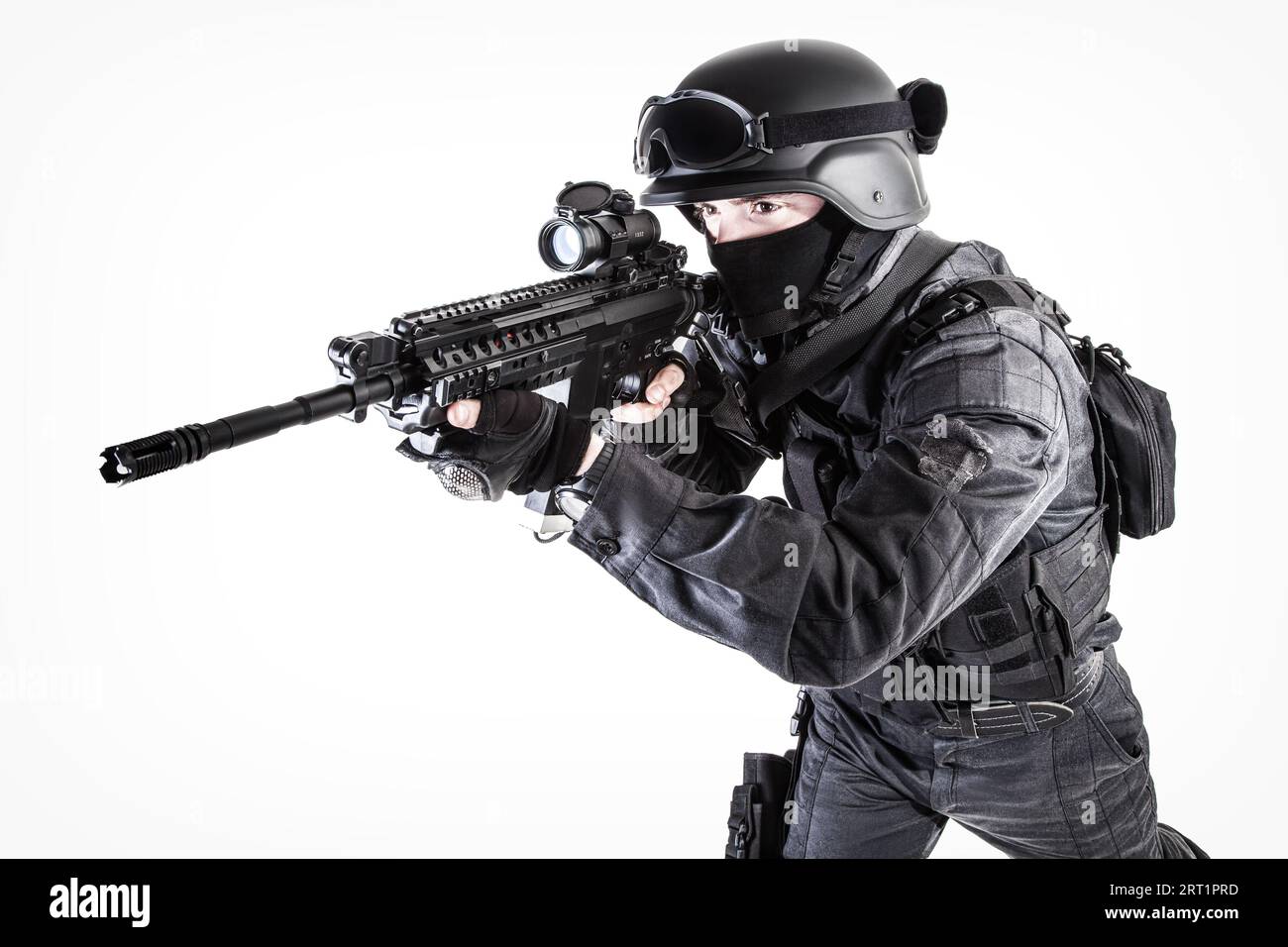Spec ops police officer SWAT in black uniform aiming service rifle ...