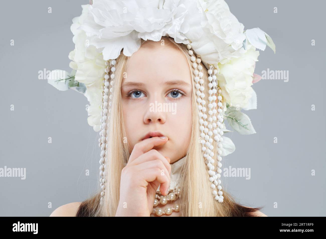 Renaissance spring portrait of young girl wearing pearls and white ...