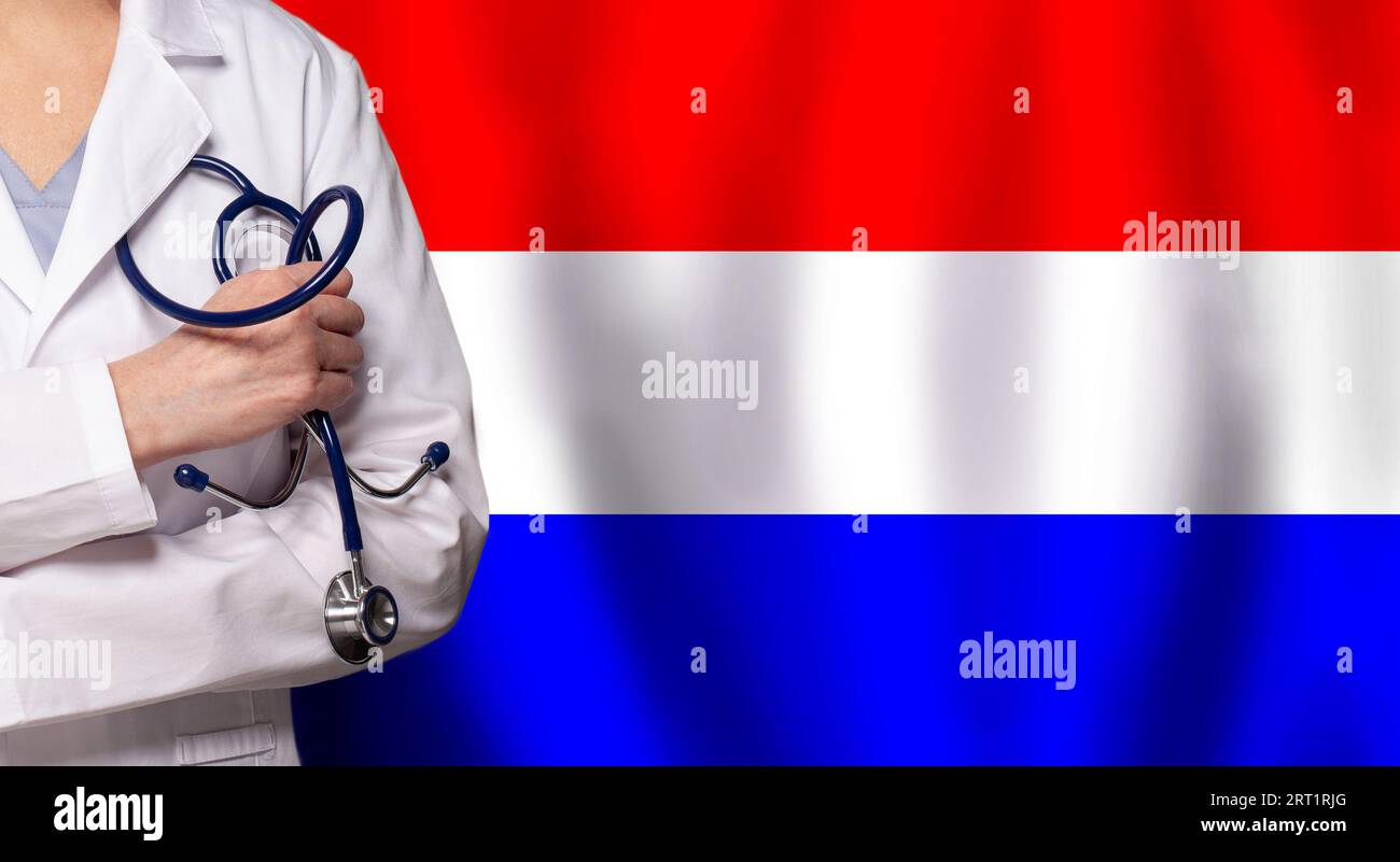 Dutch medicine and healthcare concept. Doctor close up against flag of ...