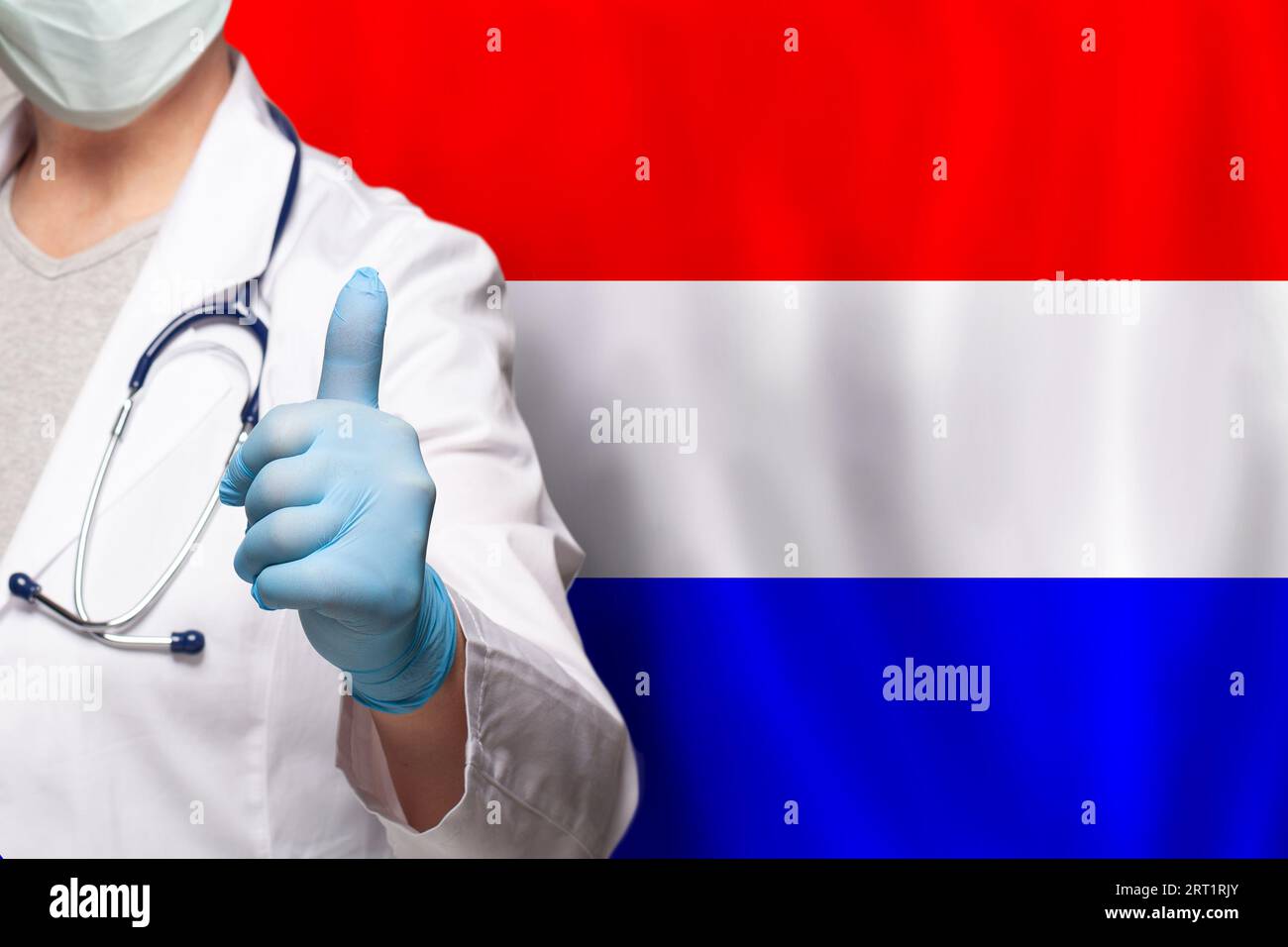 Dutch doctor's hand showing thumb up positive gesture on flag of ...
