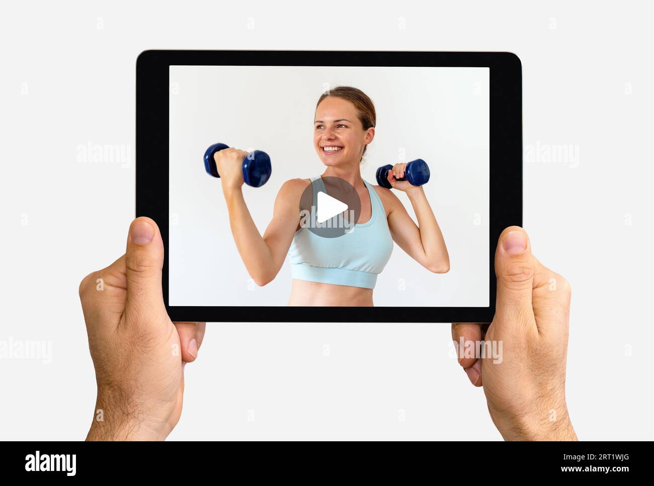 Athletic young woman with dumbbells in her hands on screen of digital ...