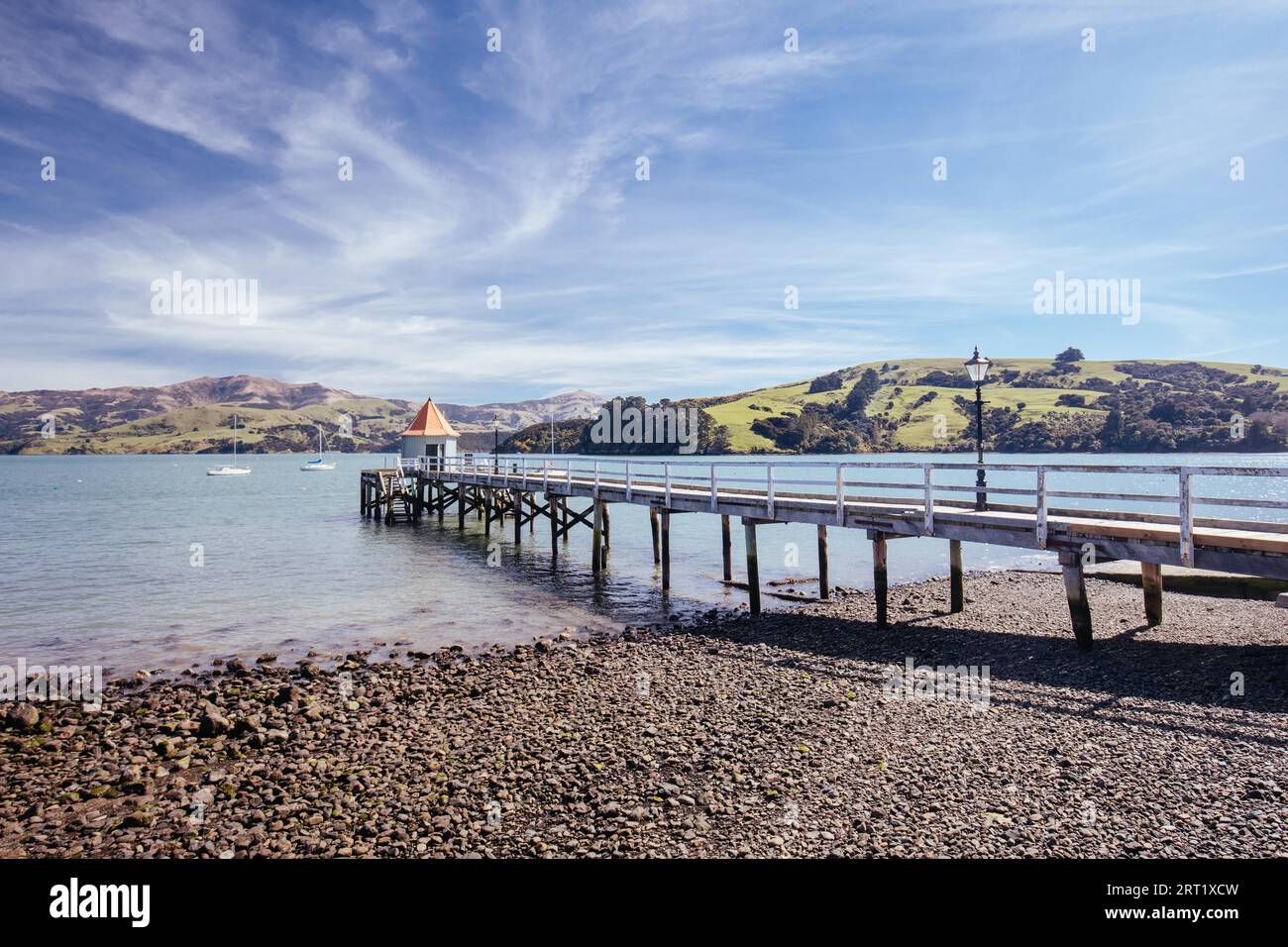 A pier in the French settlement of Akaroa on Banks Peninsula in New ...