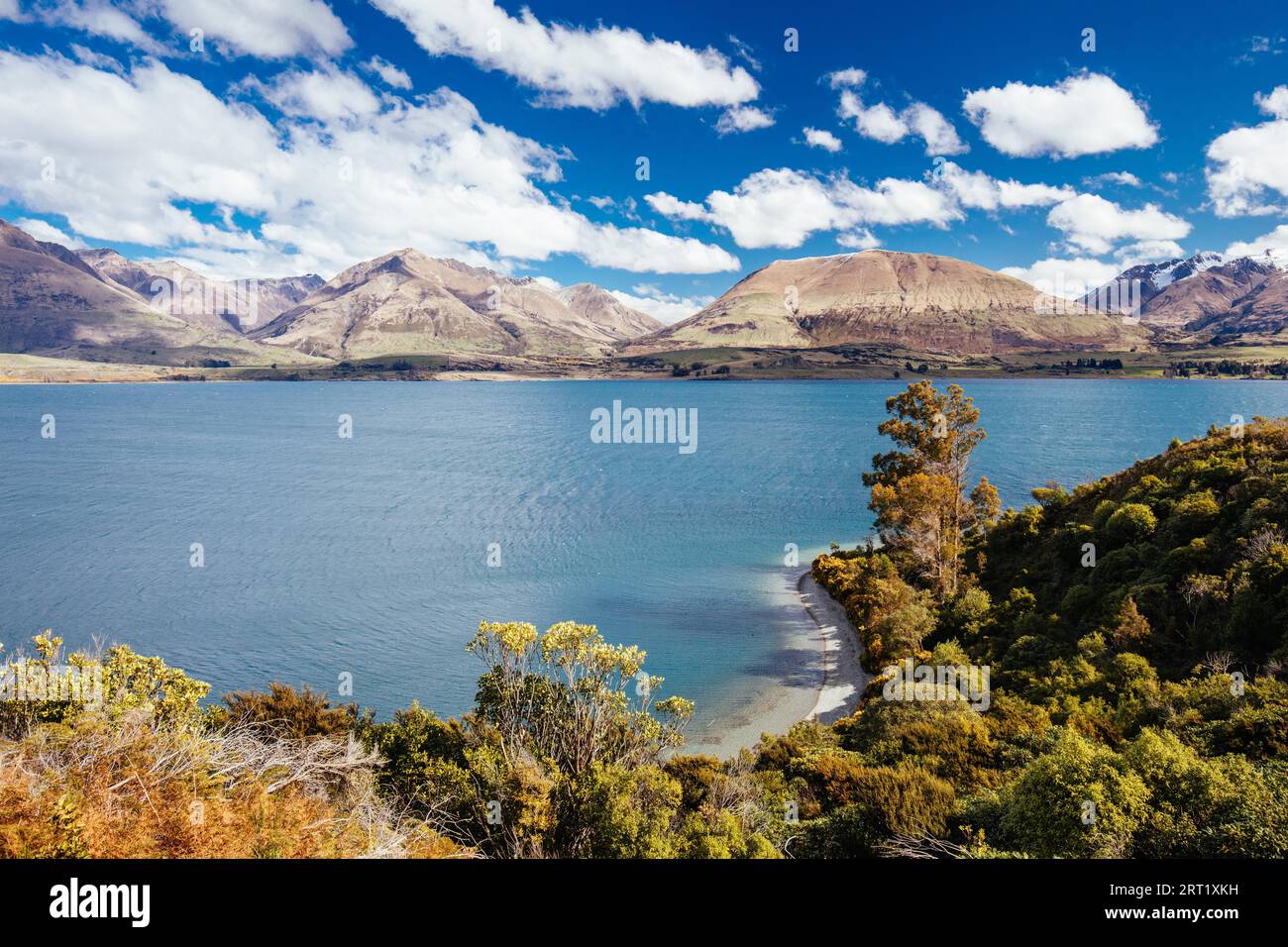 Lake Wakatipu and surrounding mountains, known as Tooth Peaks, on a ...