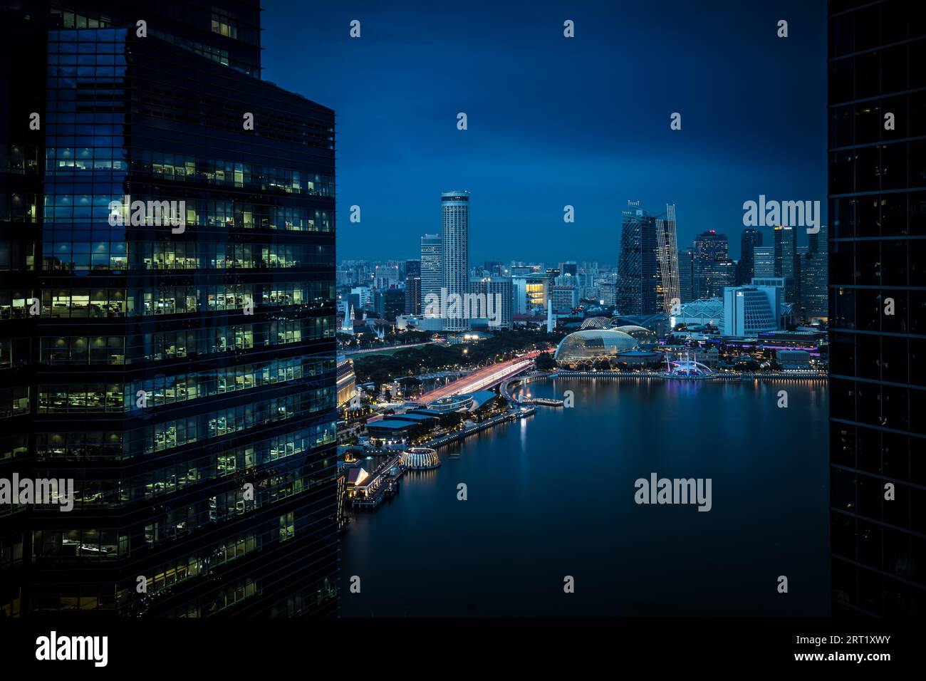 Gritty urban Marina Bay view in Singapore at night Stock Photo - Alamy